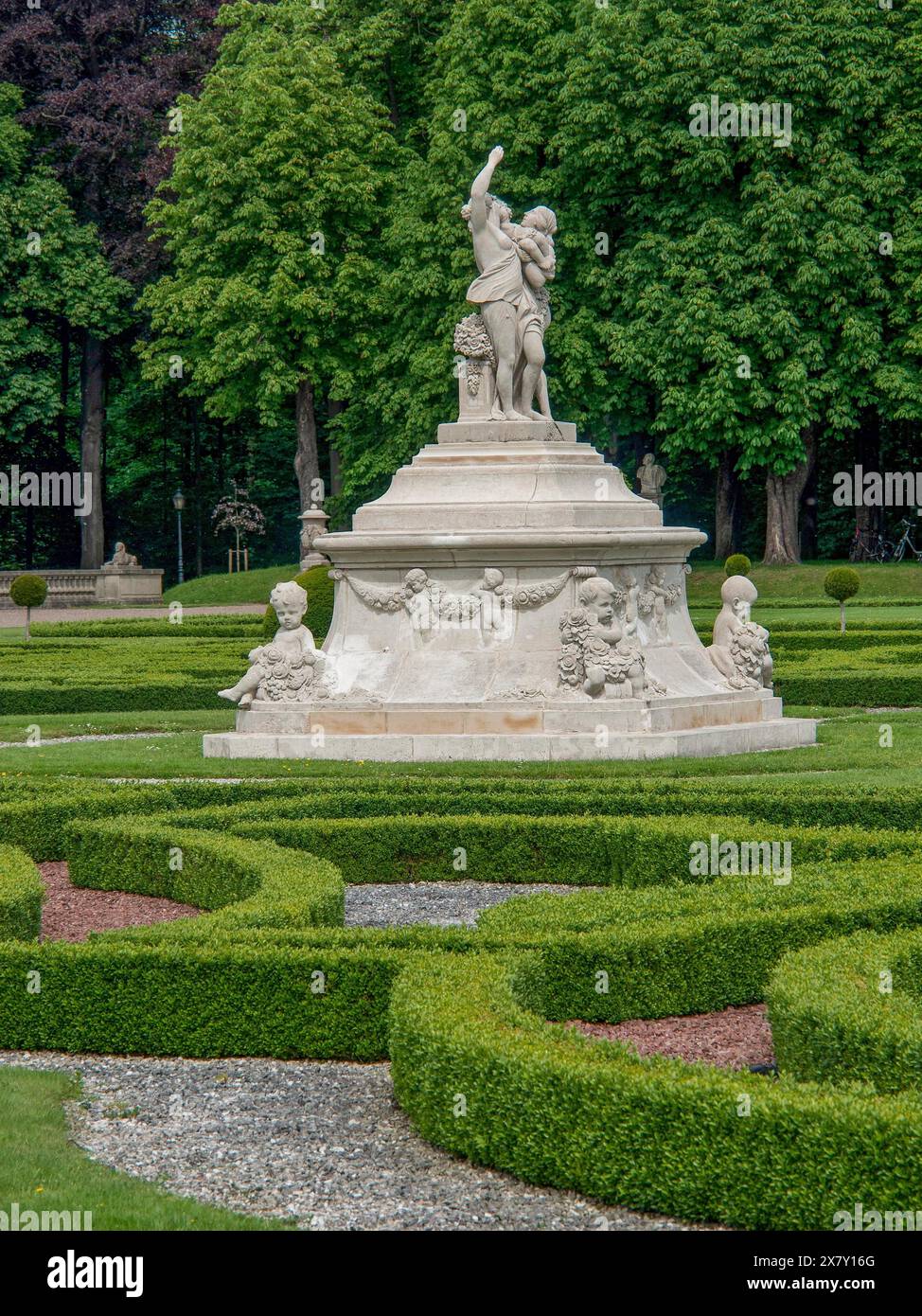 Monumental fountain with several sculptures in a well-kept baroque ...