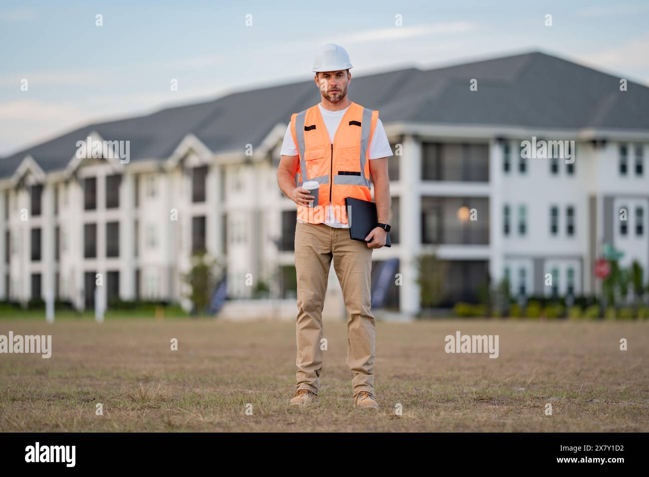 Portrait of builder in a construction site. Builder ready to build new ...