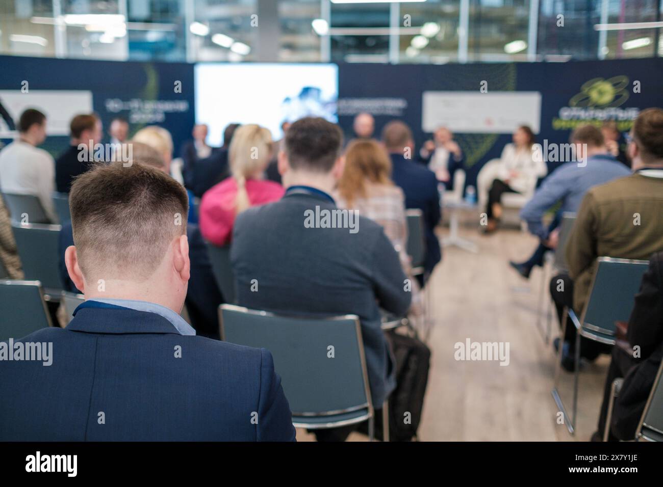 Attendees focus on professional panel hi-res stock photography and ...