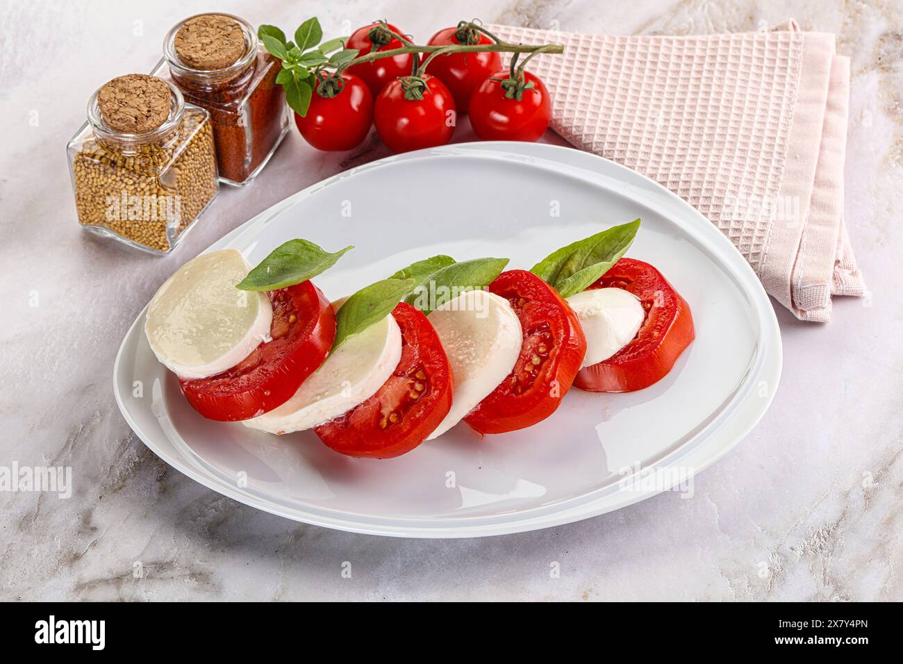 Italian caprese salad with mozzarella, tomato and basil Stock Photo - Alamy