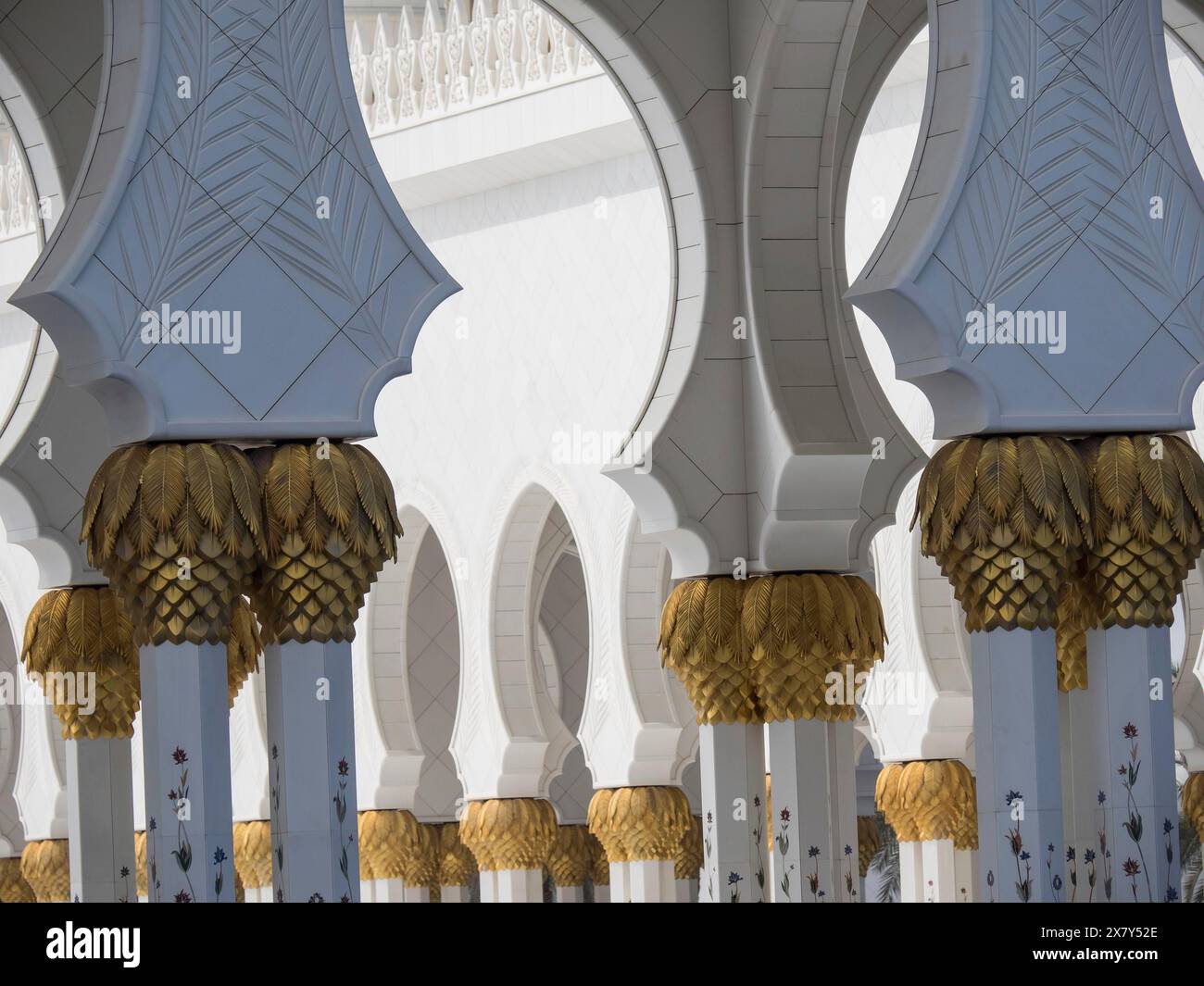 Detailed view of columns with golden decorations and floral patterns ...