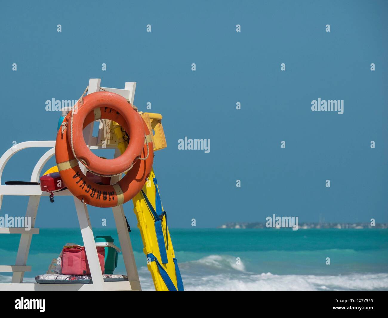 A lifeguard station with lifebuoy and equipment stands on the beach ...