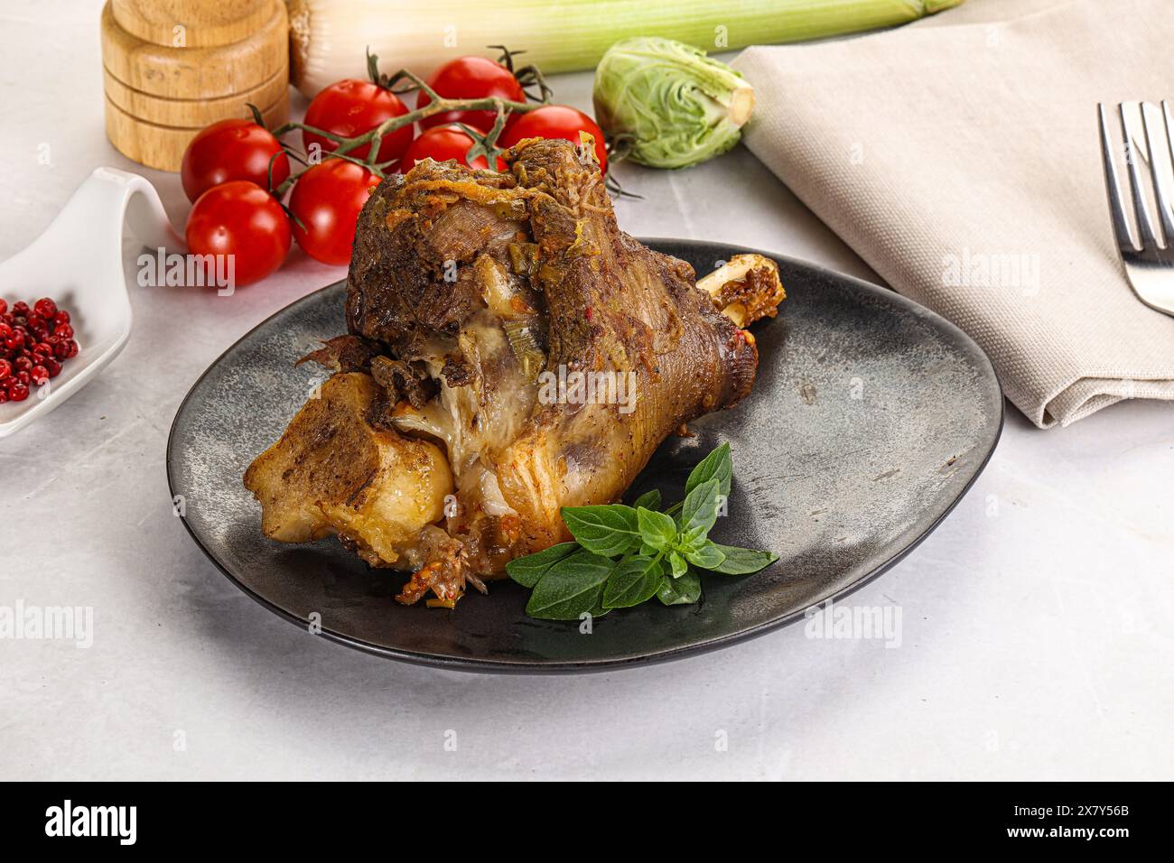 Baked Lamb shank with bone marinated in spices Stock Photo - Alamy
