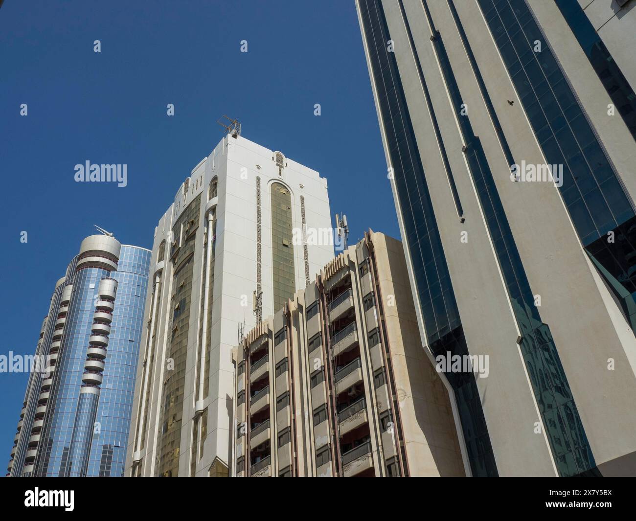Several skyscrapers with a mixture of architectural styles and glass ...