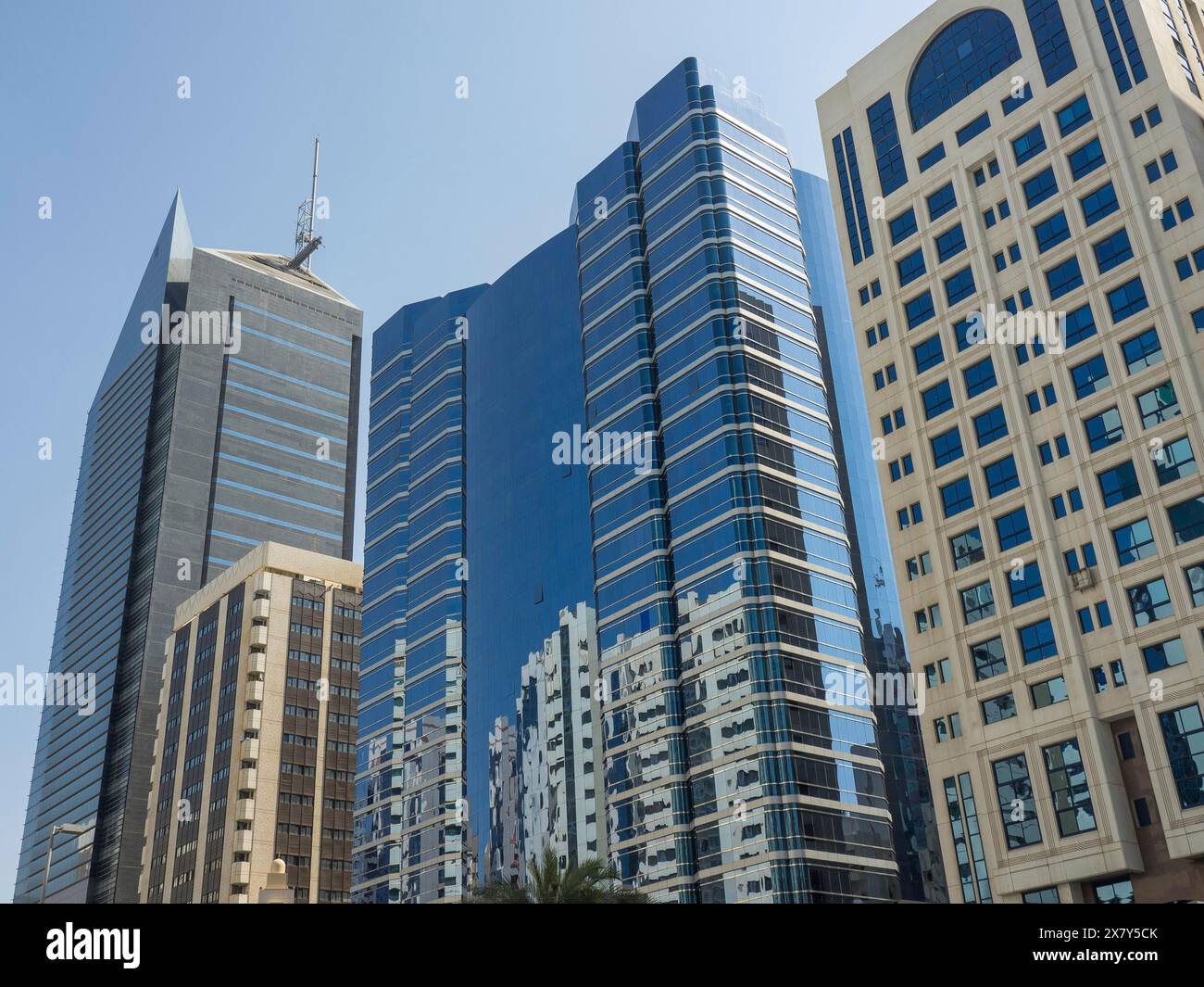 Several skyscrapers with reflective facades and modern design in an ...