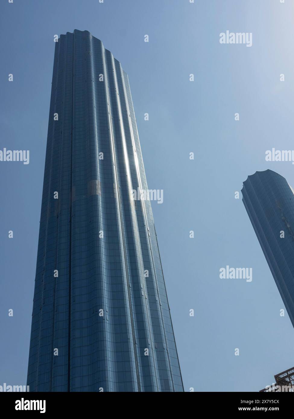 Tall, slender skyscrapers with minimalist architecture against a bright ...