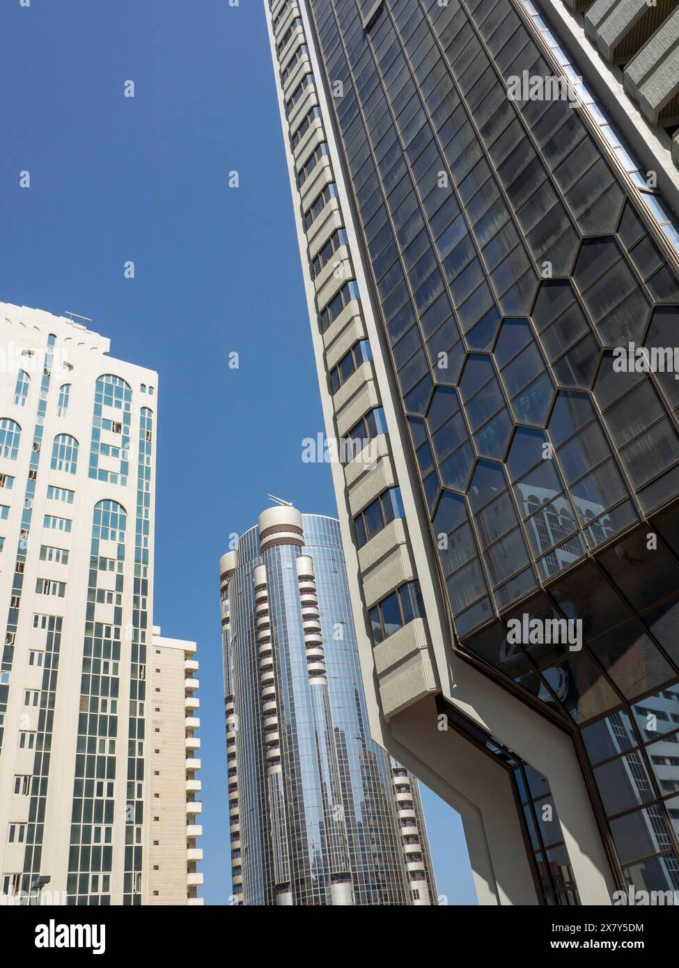 Large skyscrapers with glass facades reflecting the blue sky, modern ...