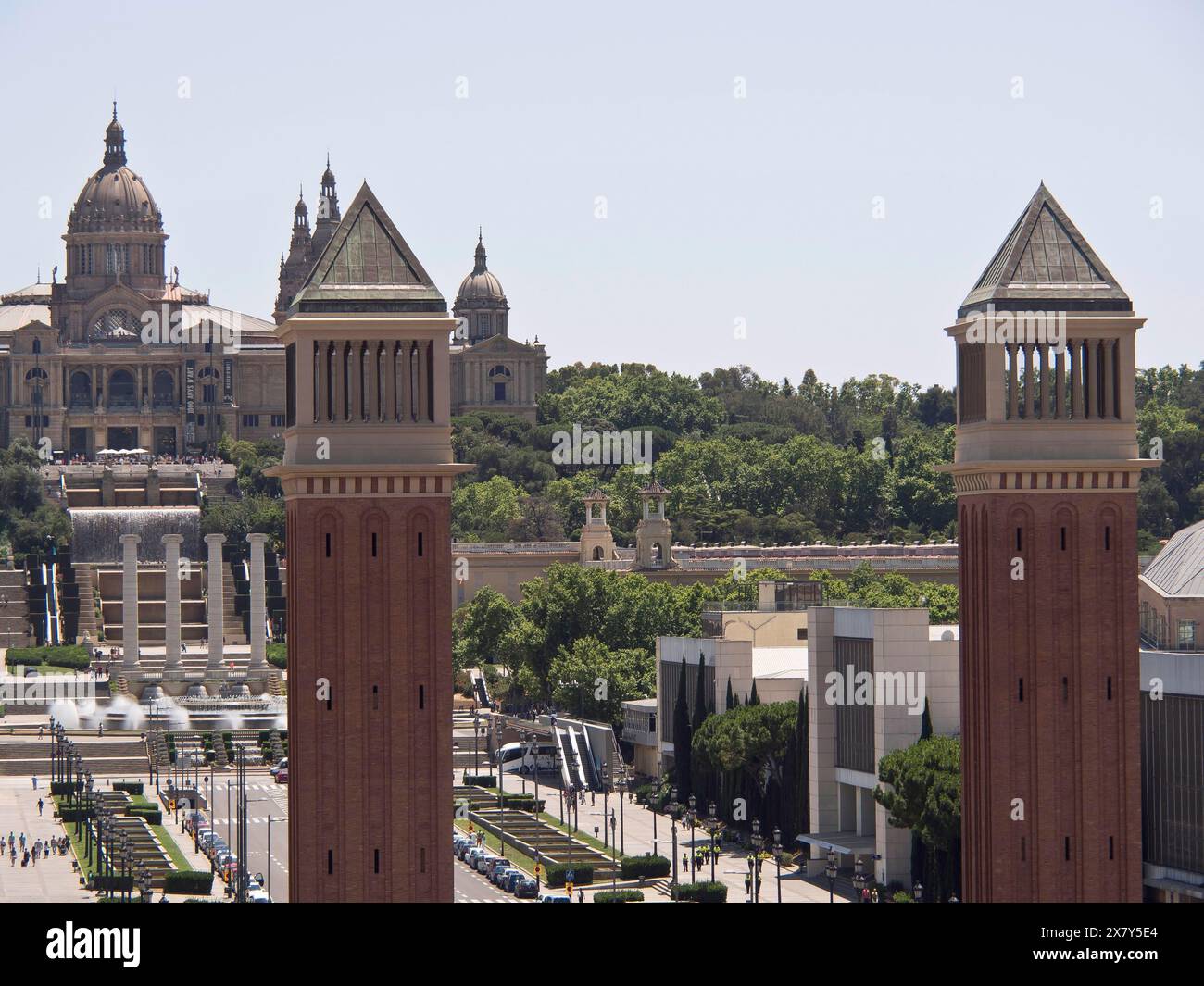 Two tall towers flanking a magnificent historic building, surrounded by ...