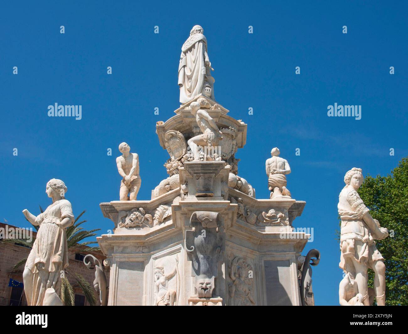 Historical marble statue with figures and clear blue sky in the ...