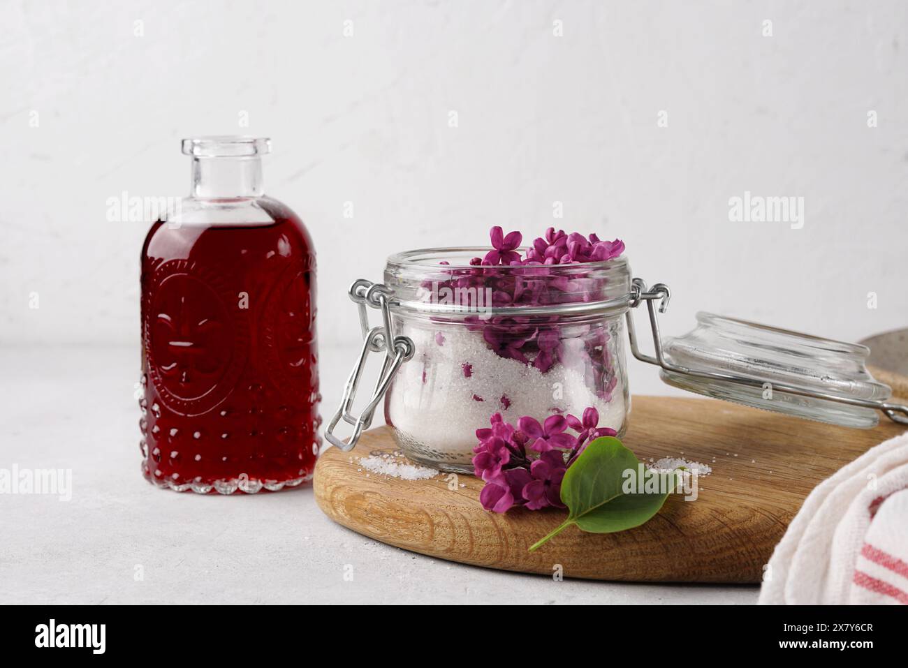 Preparation of syrup from the flowers of lilac. Glass jar, wooden board ...
