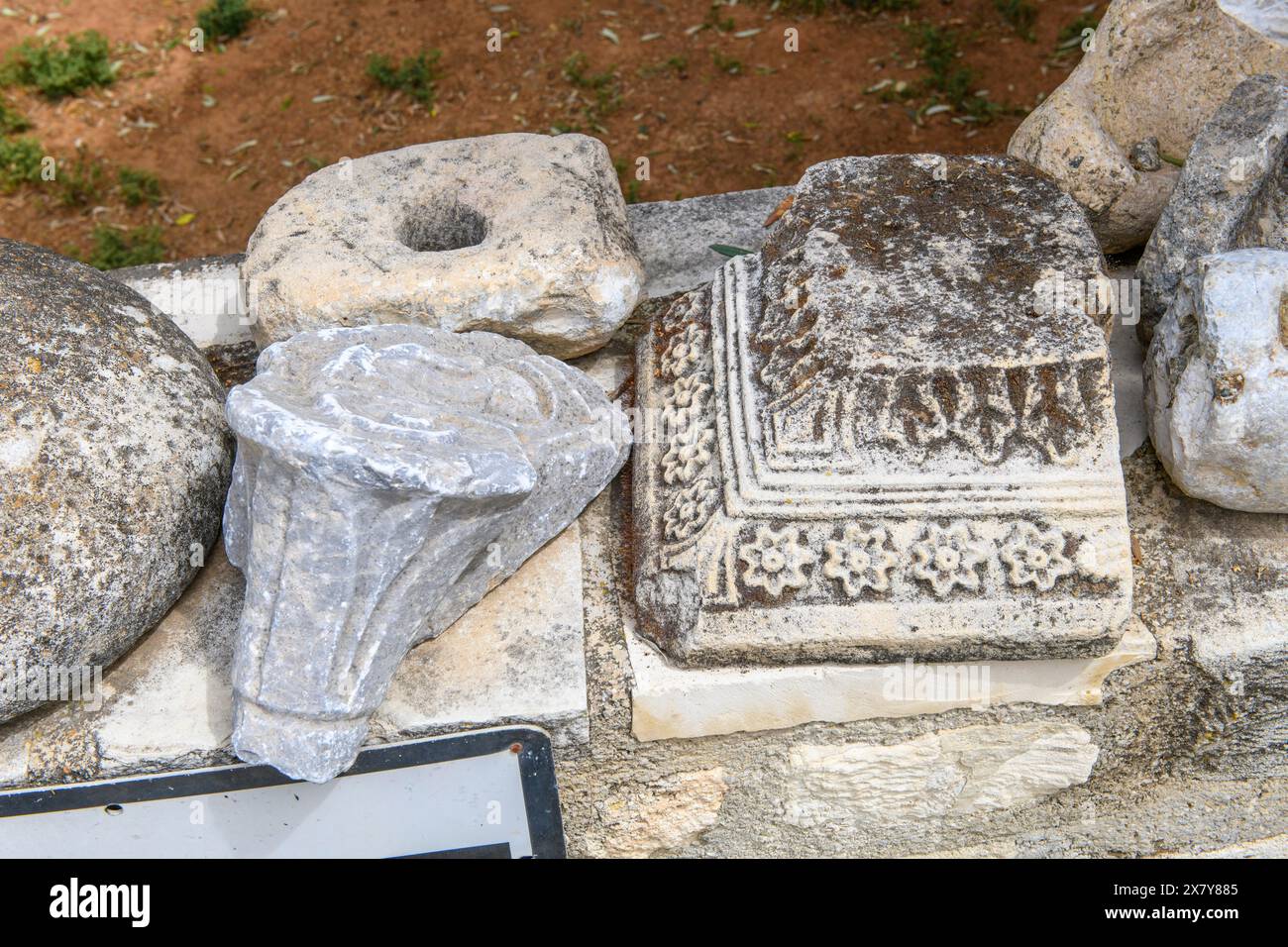 Decorated fragments of walls columns worked by ancient stonemasons in ...