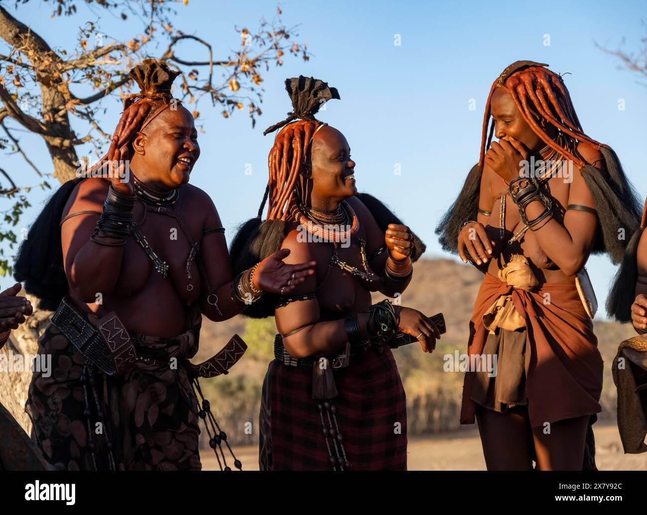 Traditional Himba woman clapping and laughing, music and dance ...