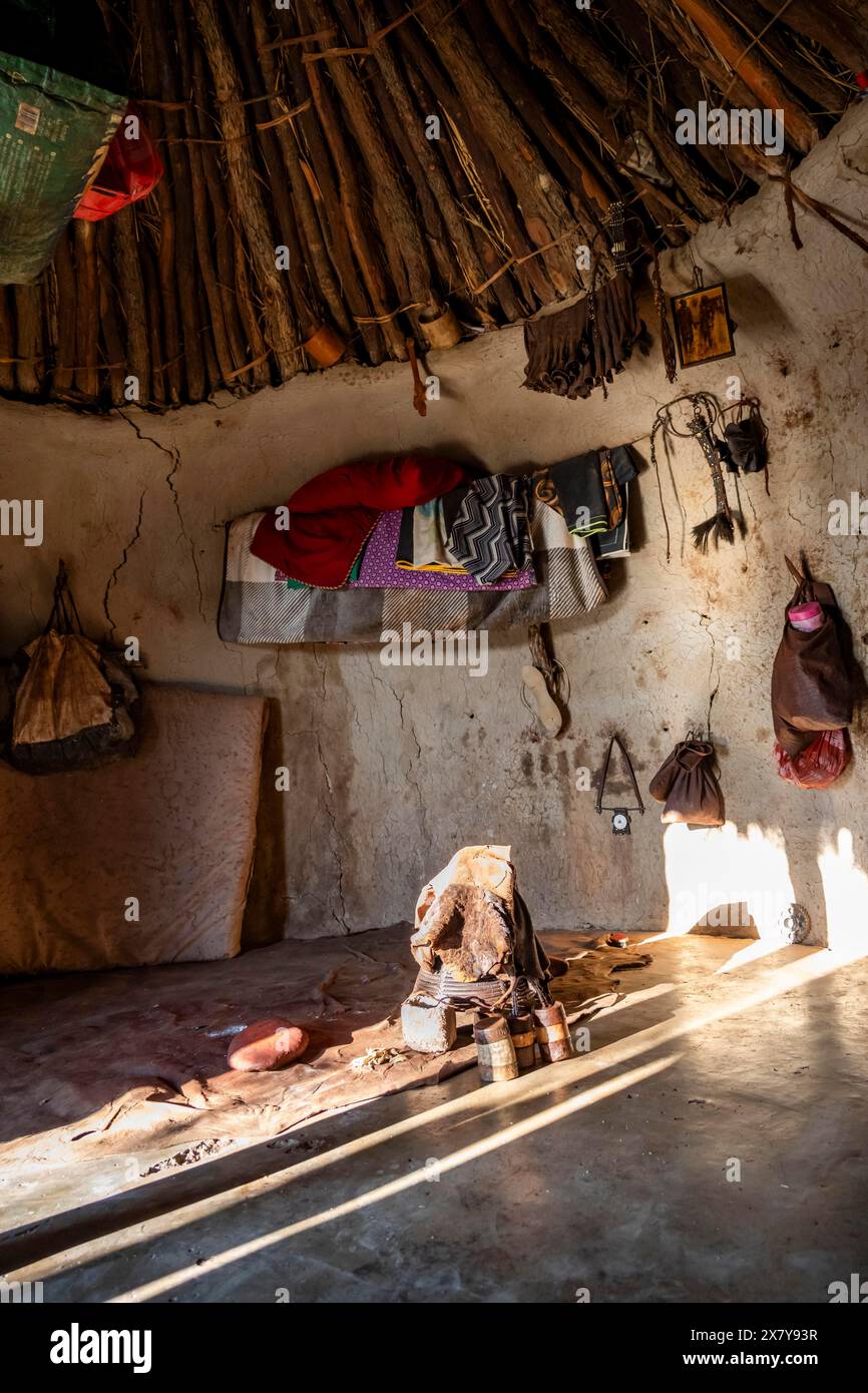 Interior of a first woman's mud hut in a Himba village, traditional ...
