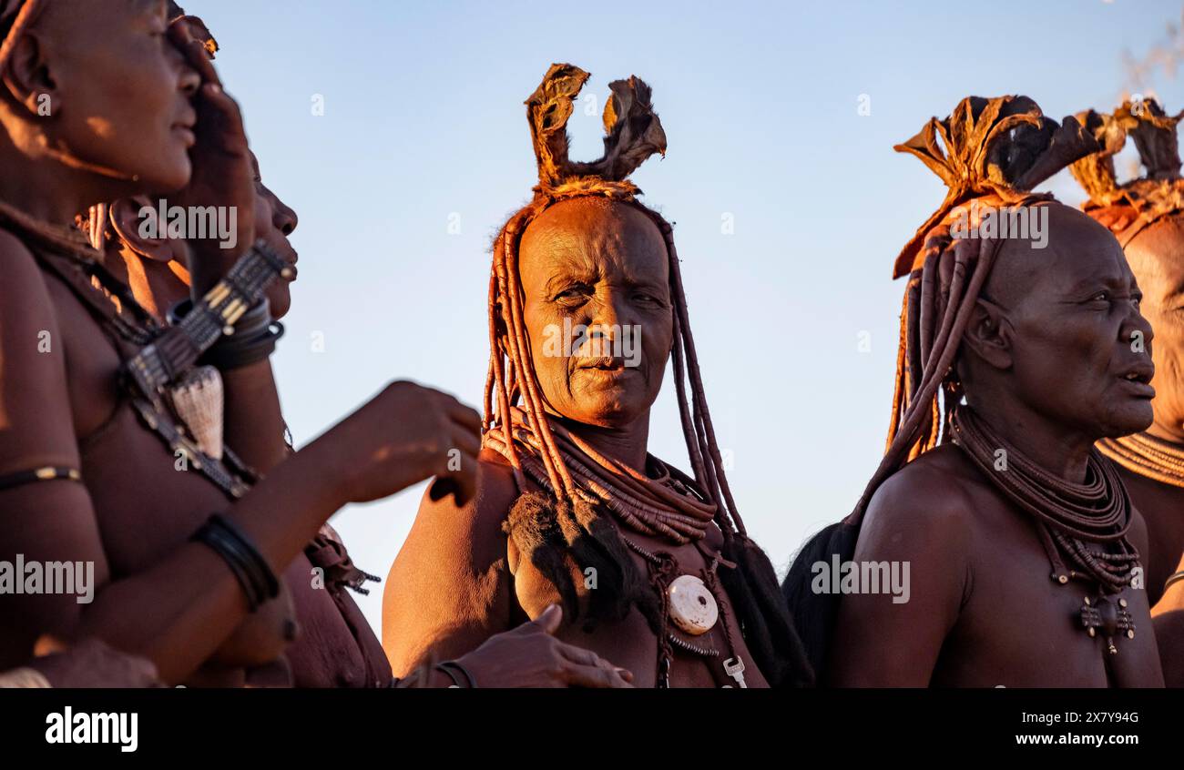 Traditional Himba woman clapping, music and dance, portraits, in the ...