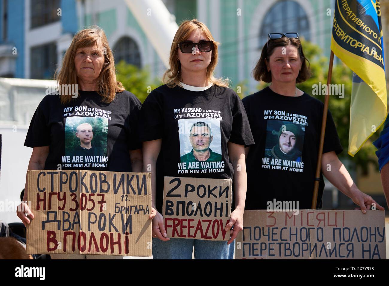 Sad Ukrainian women posing with portraits of their missing relatives ...