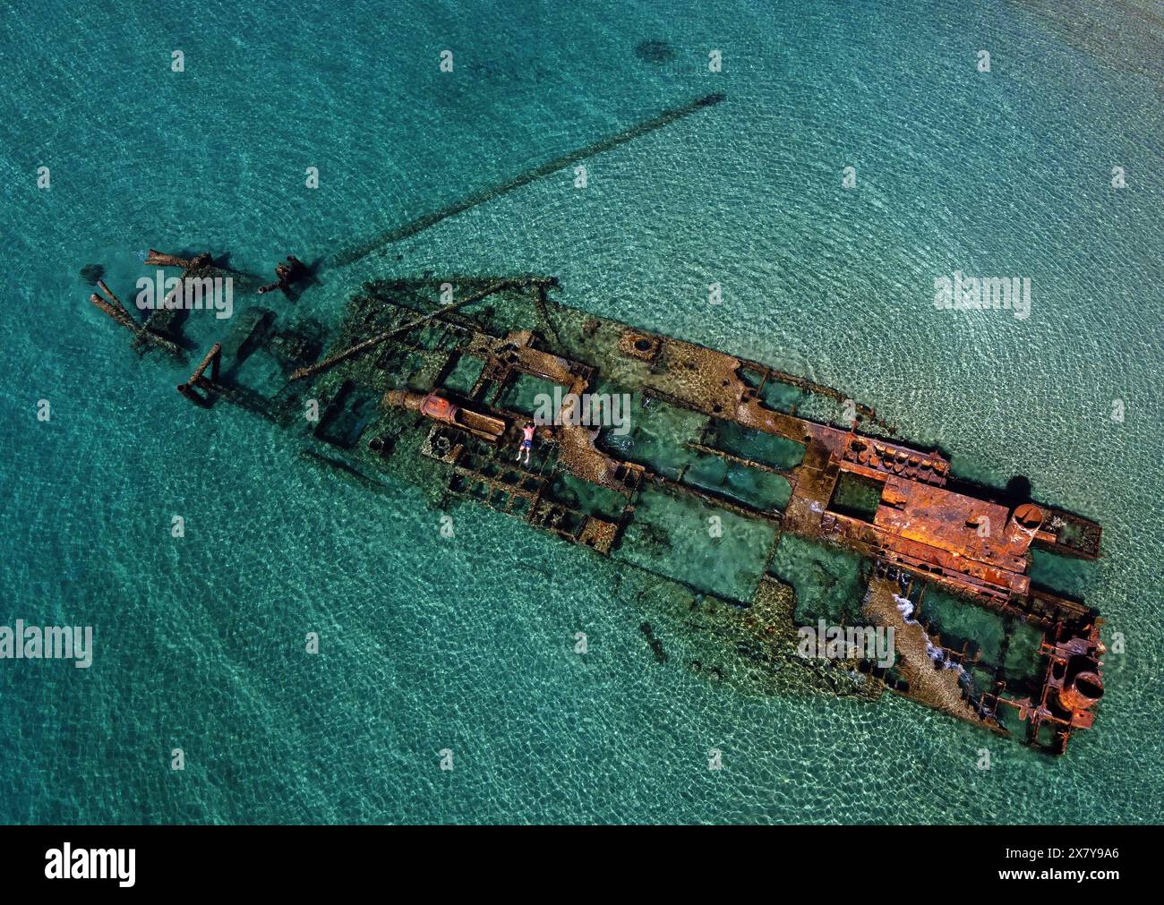 Greece, People dive into the crystal clear waters of the Mediterranean ...