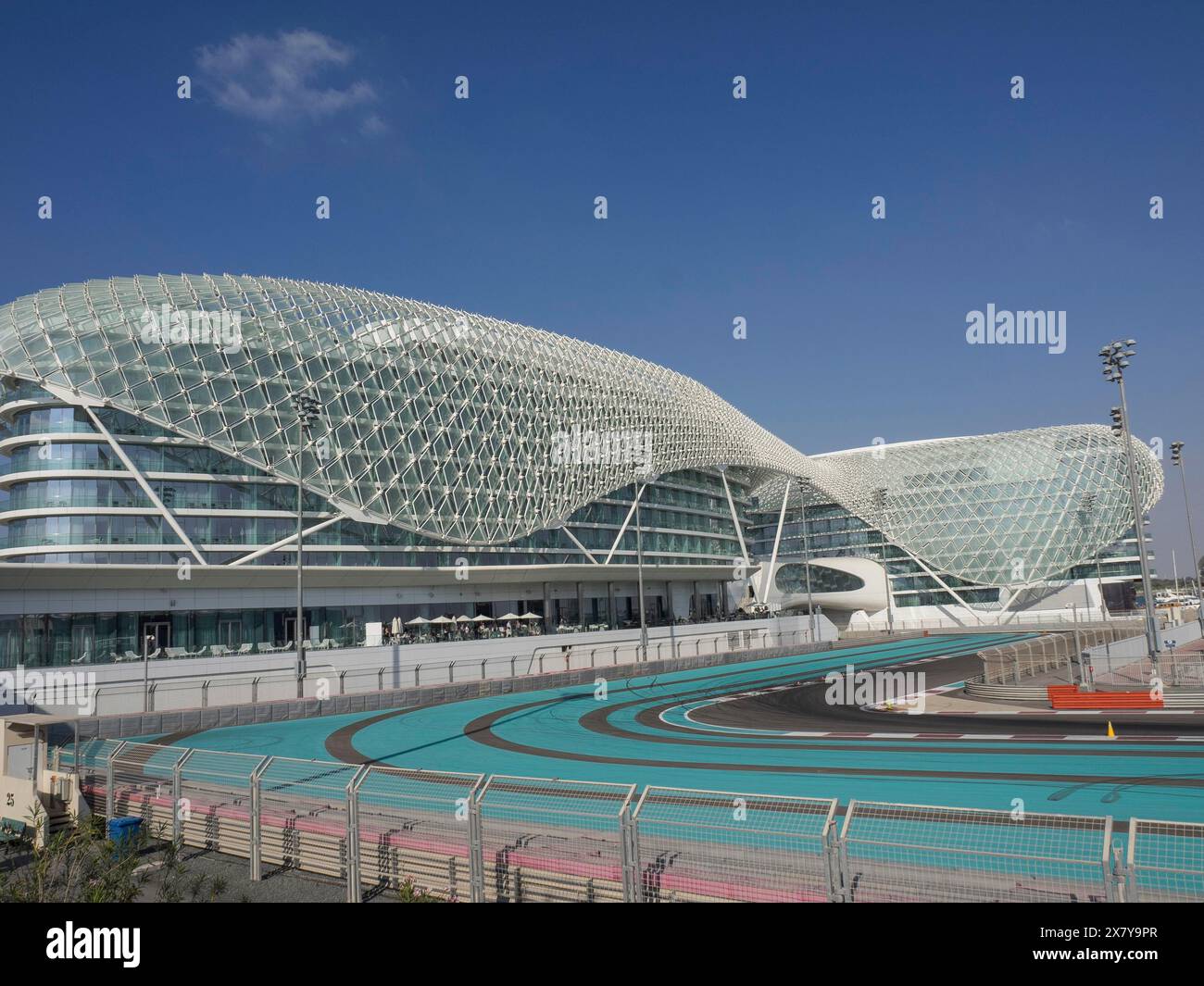 Spacious racetrack with modern, glass-covered buildings and clear ...