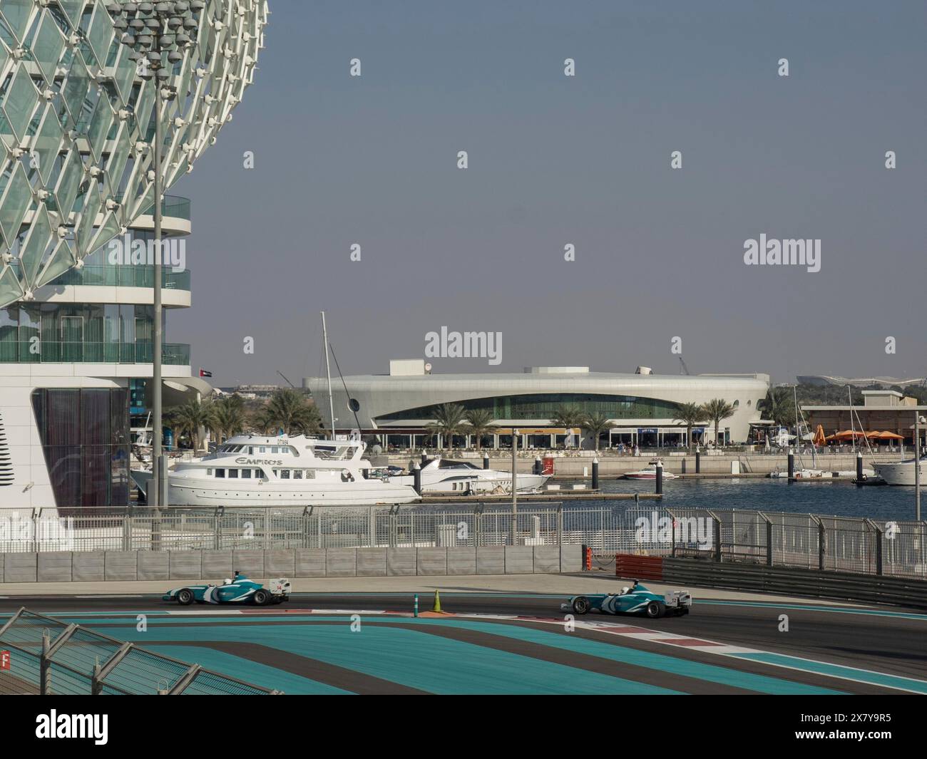 Modern building complex overlooking the marina and a race track ...