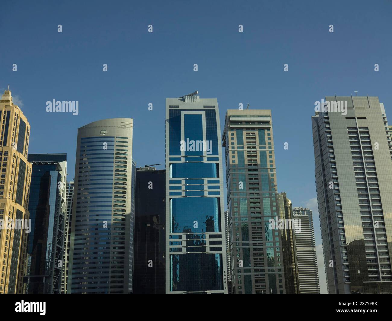 Five skyscrapers with differently coloured glass facades rise into the ...