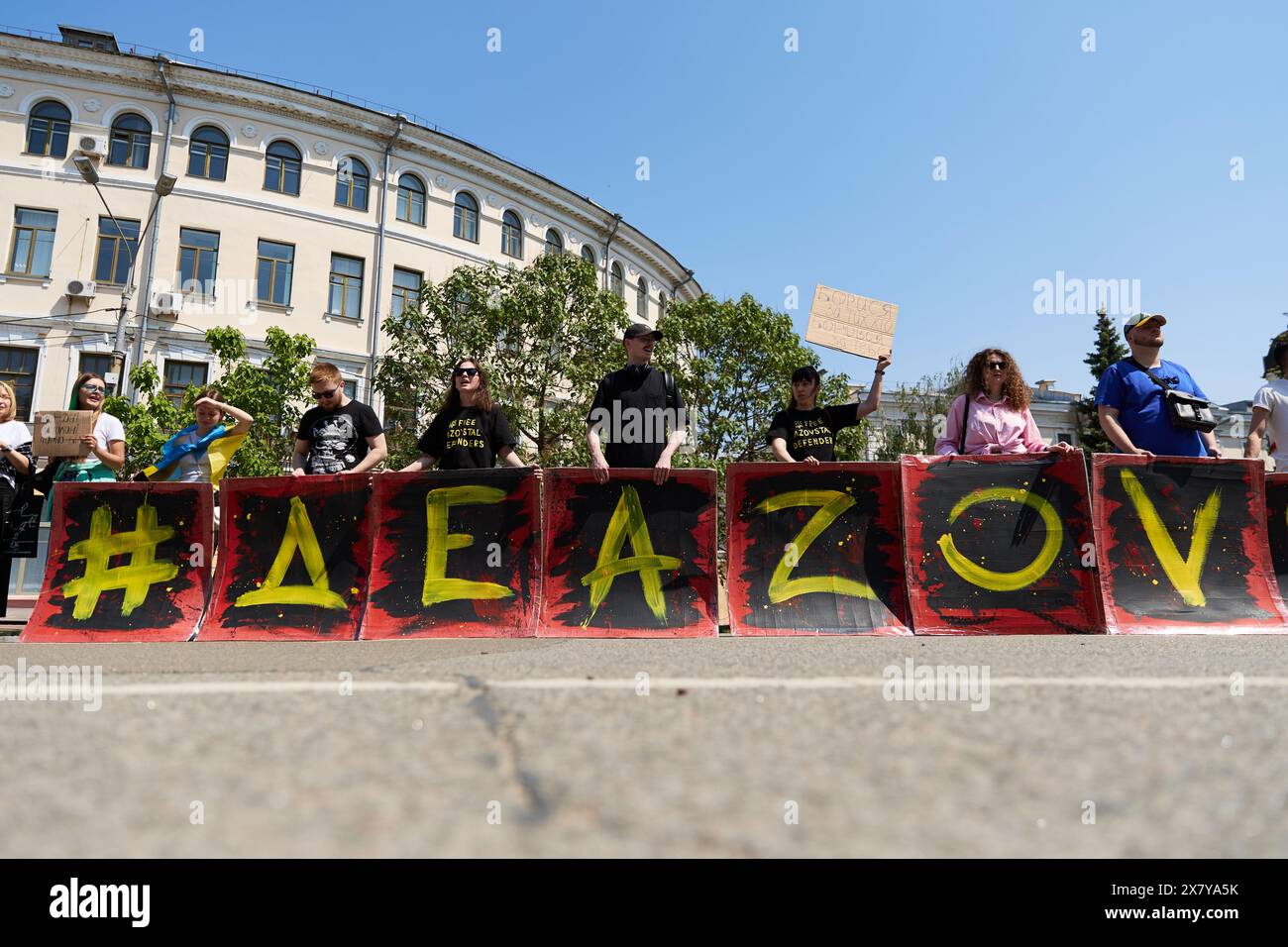 Activists posing with a banner "Free Azov" on a public demonstration in ...