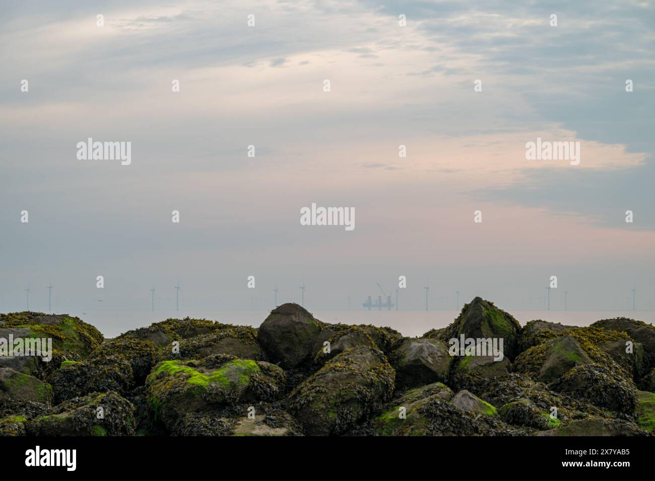 The breakwater, drilling platform and wind farm at Rhos-on-Sea, Wales ...