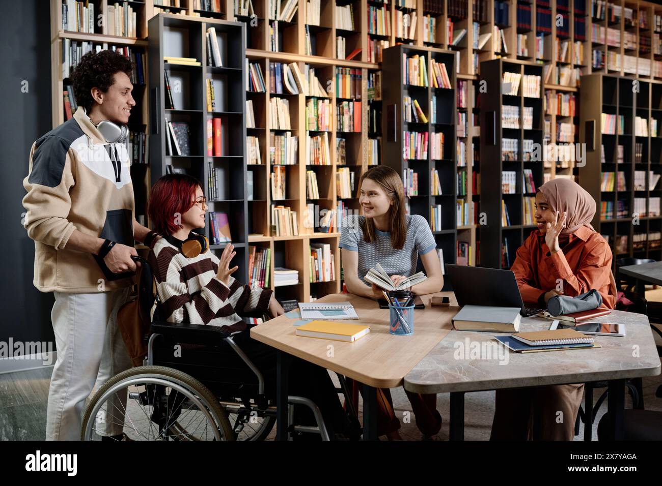 Group of diverse gen Z male and female students gathering in modern ...