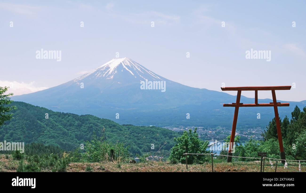 a traditional red Torri gate in front of the fuji mountain Stock Photo ...