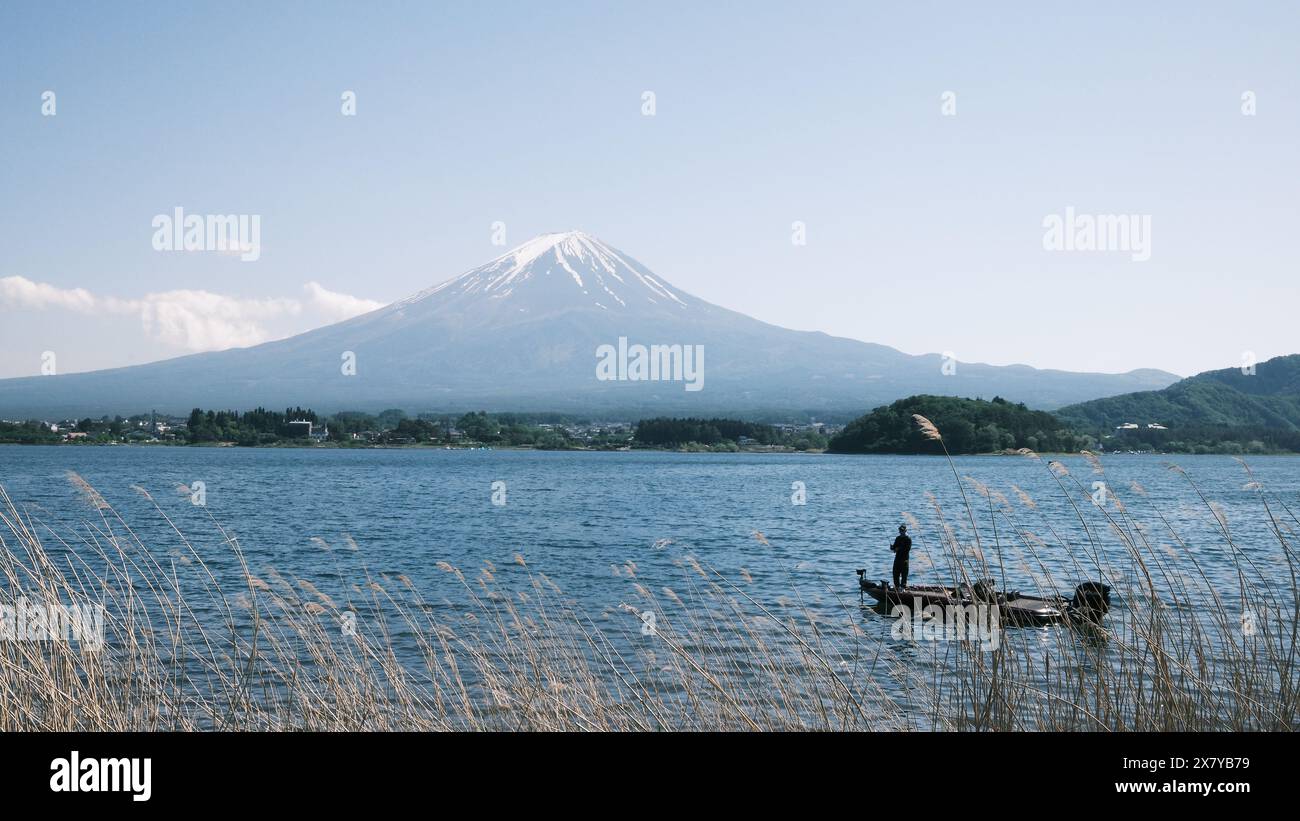 visitor fishing on the boat with the background of fuji, in kawaguchiko ...