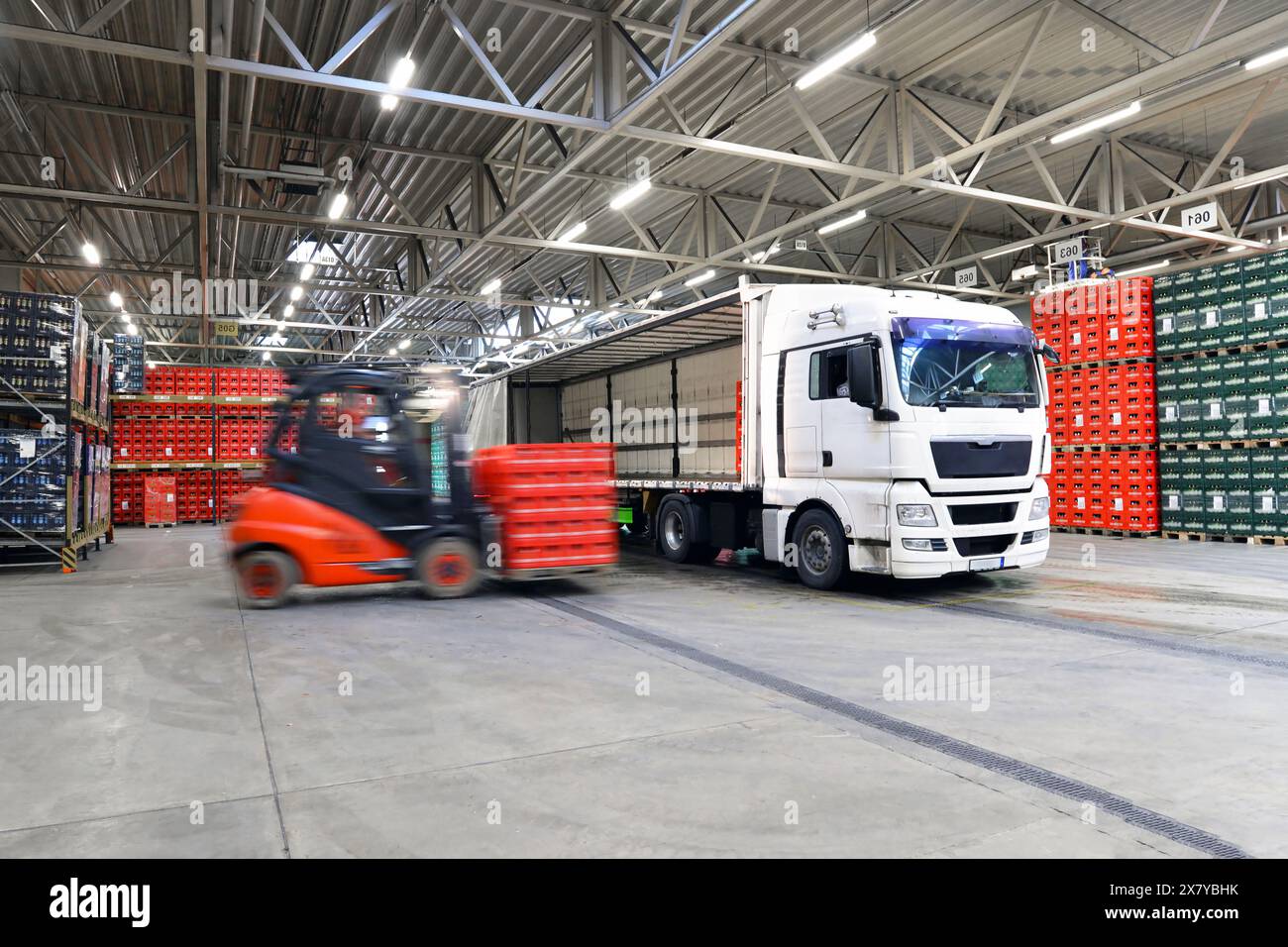 loading of beer crates for trade in a brewery - forklift trucks and ...