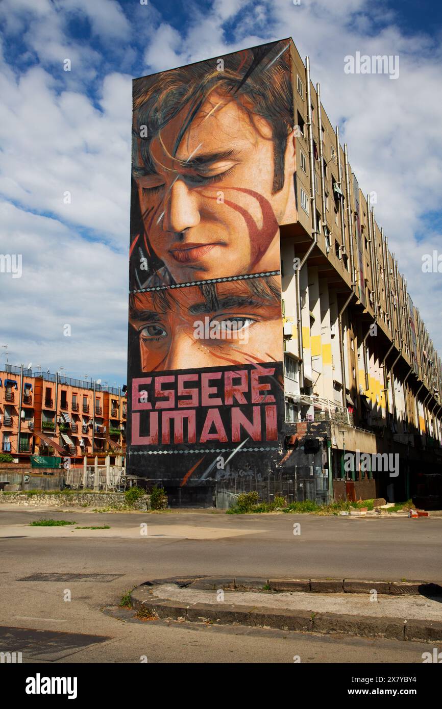 Street artist Jorit's mural of Maradona on a building in Naples, Italy ...