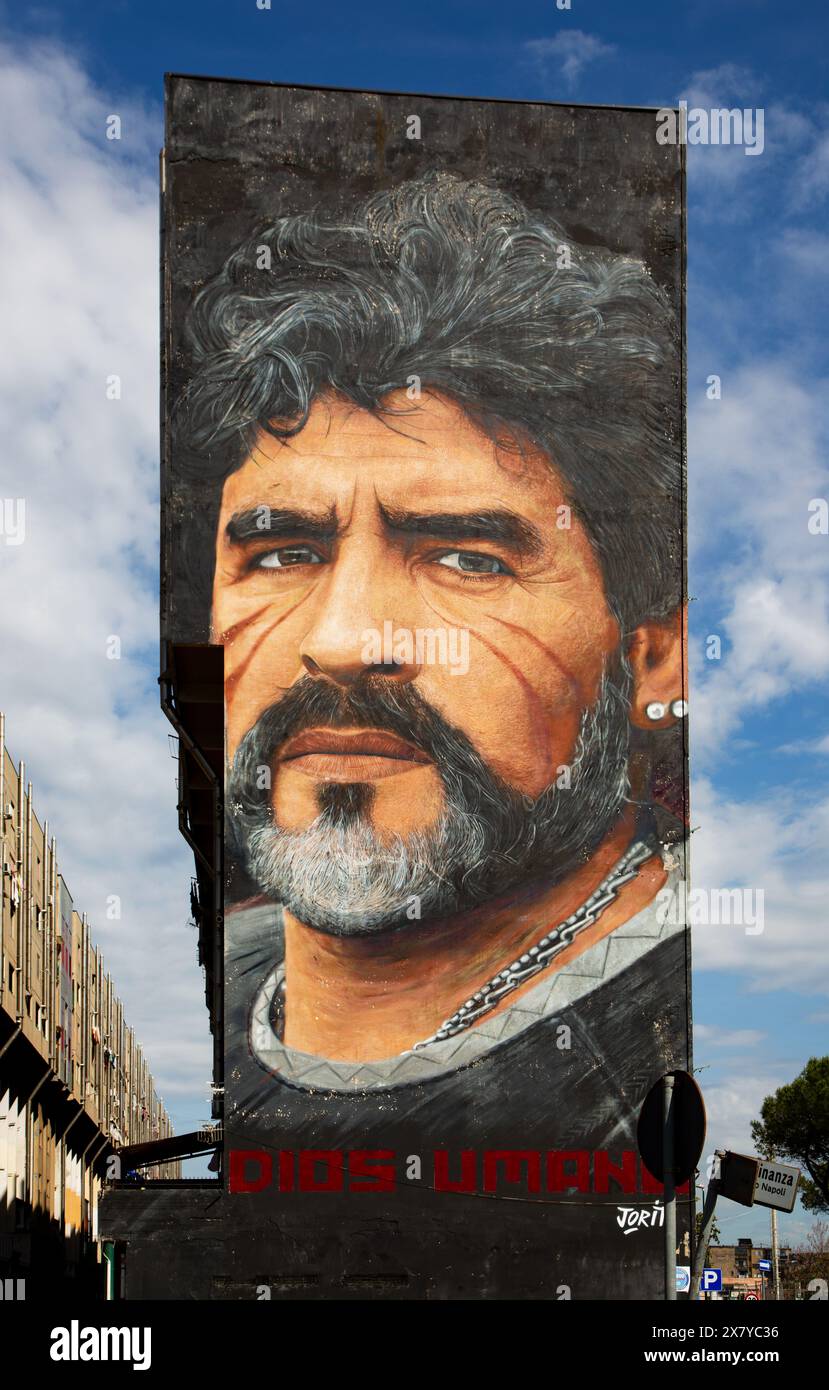 Street artist Jorit's mural of Maradona on a building in Naples, Italy ...