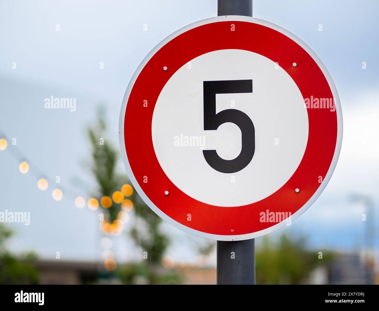 Road sign displaying speed limit of 5 km on the bicycle lane Stock ...