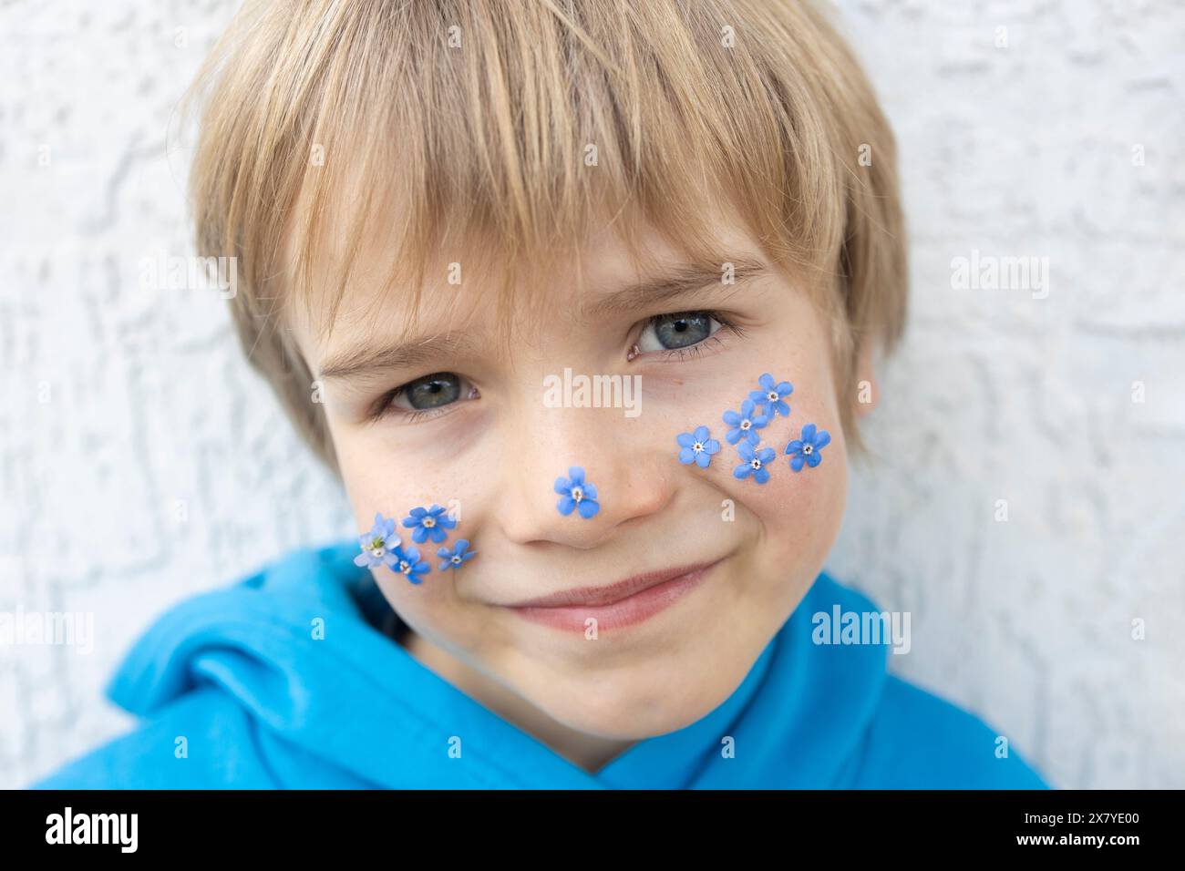 Happy spring. Close-up portrait of smiling childish face of 7-year-old ...
