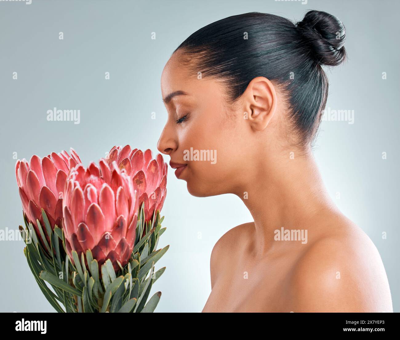Smell, woman and skincare with plant in studio on white background for ...