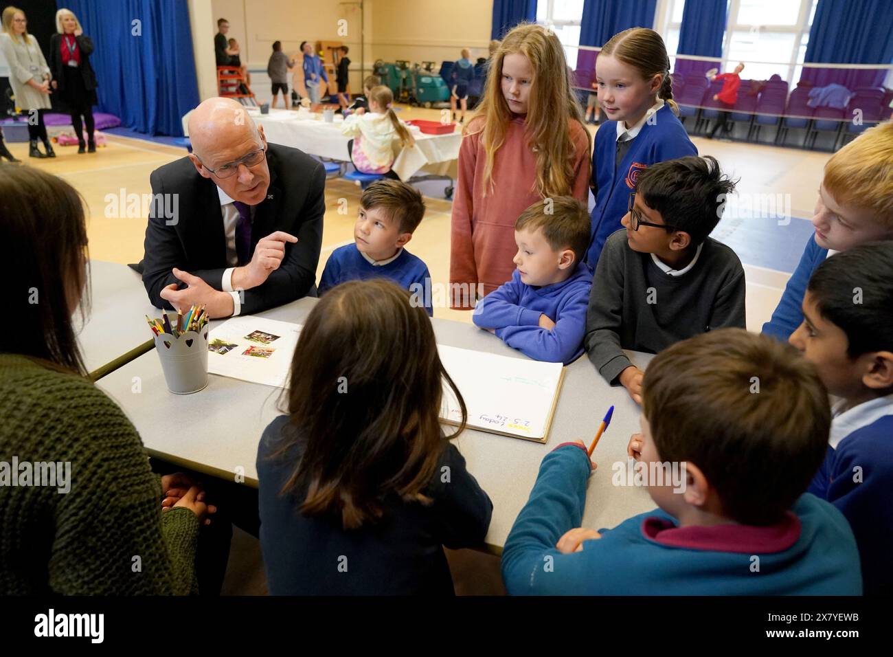 First Minister John Swinney plays badminton with children, during a ...