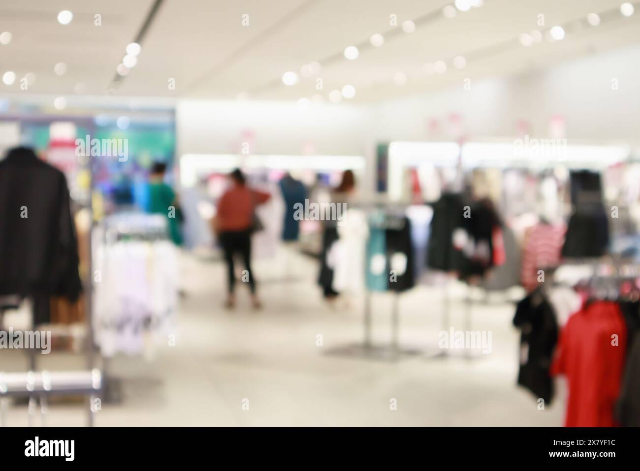 clothing store interior abstract blur background Stock Photo - Alamy