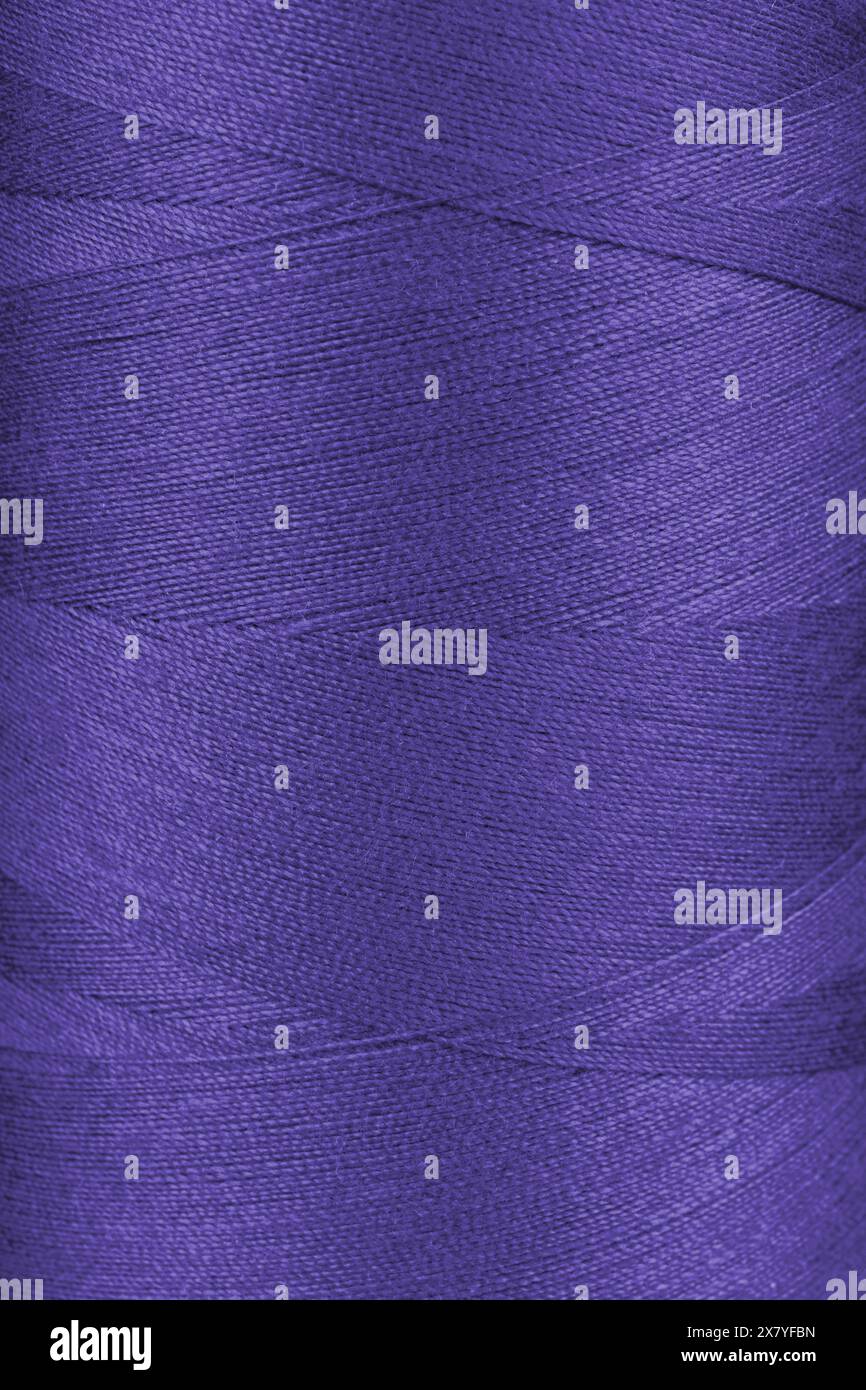 Texture of purple color threads in spool close up, macro. Sewing ...