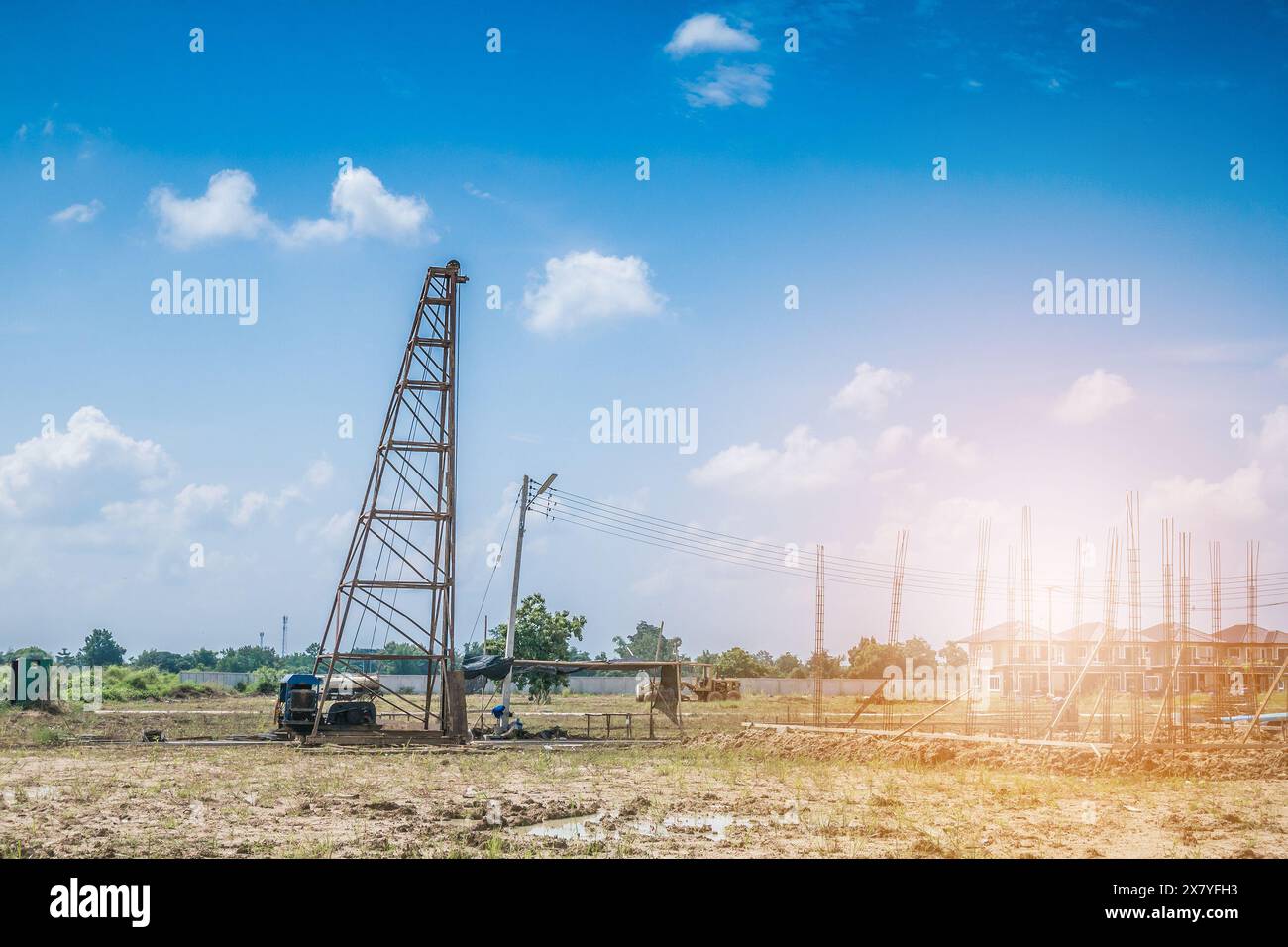 pile driver at house building construction site Stock Photo - Alamy