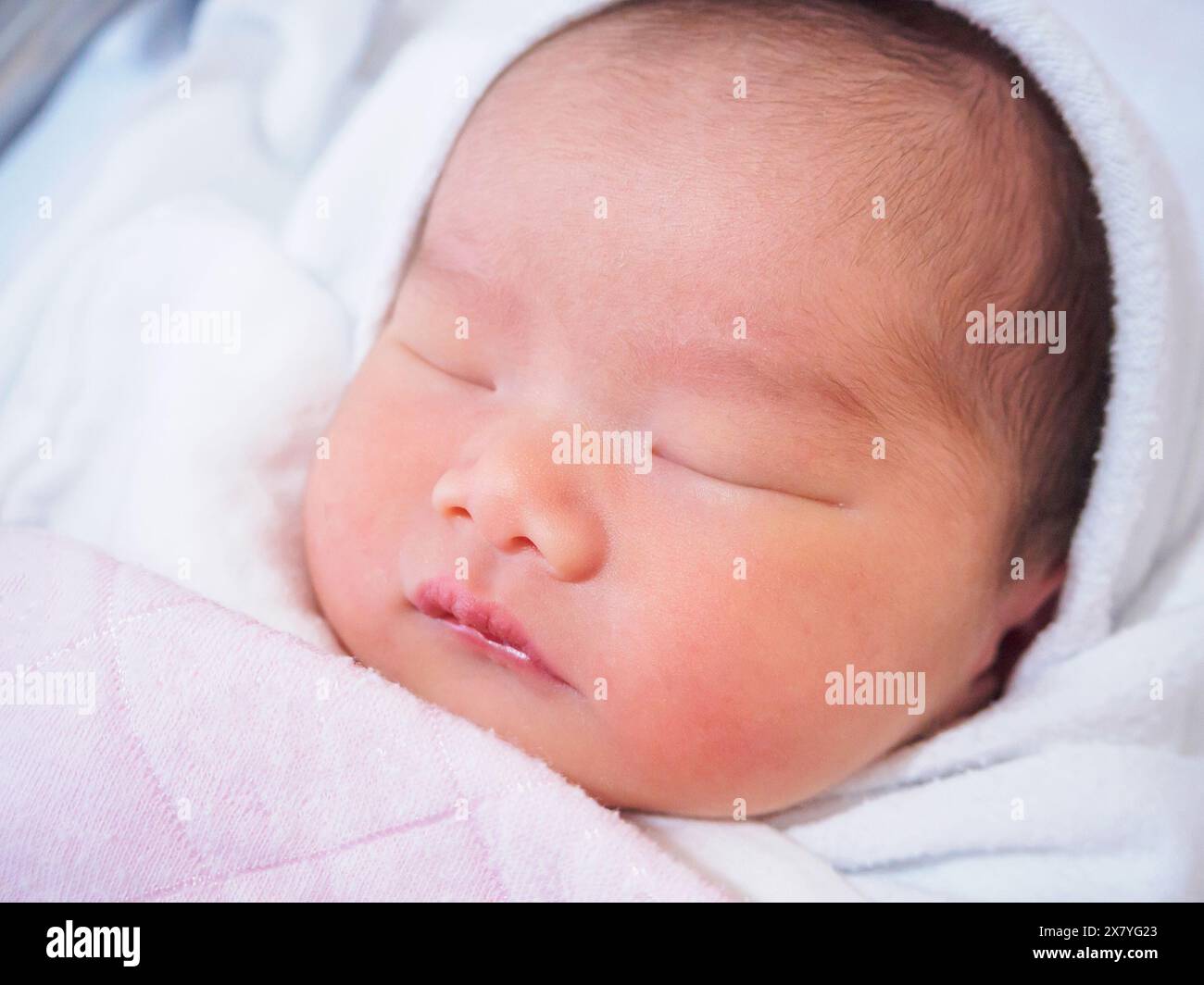 Cute newborn asian baby girl sleeping Stock Photo - Alamy