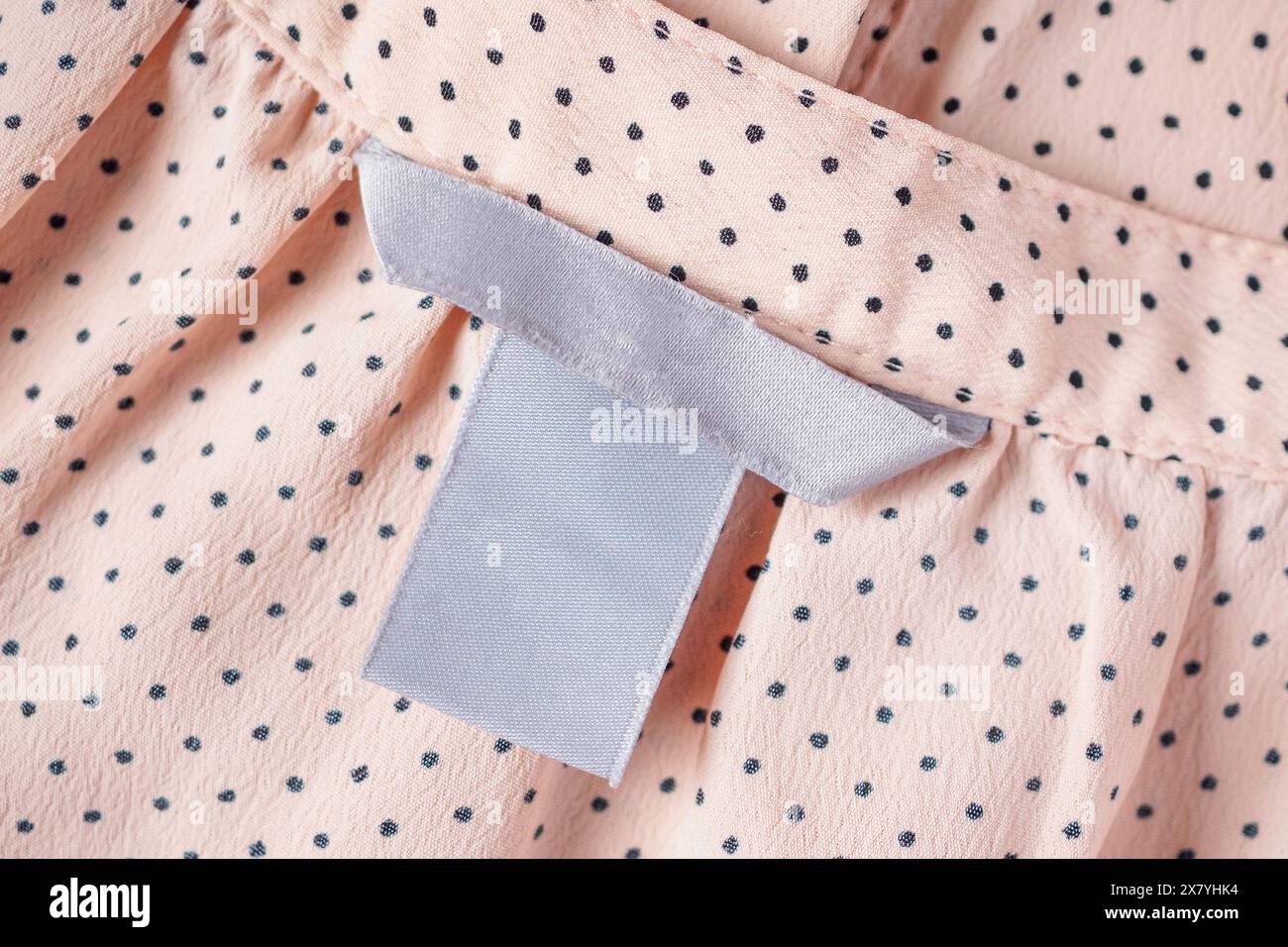 Blank Clothing label closeup on fabric texture Stock Photo - Alamy