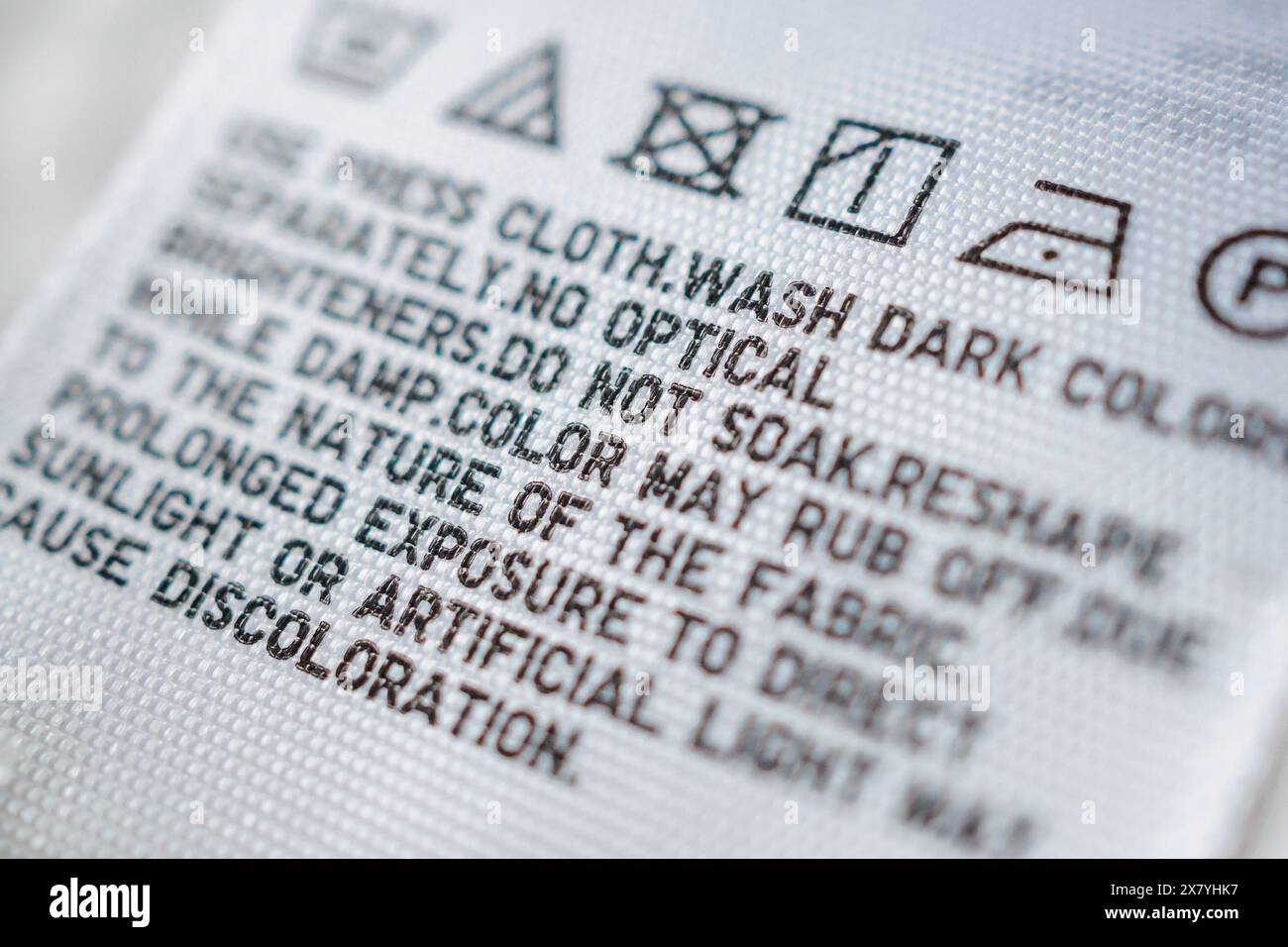 Cloth label tag with laundry care instructions Stock Photo - Alamy