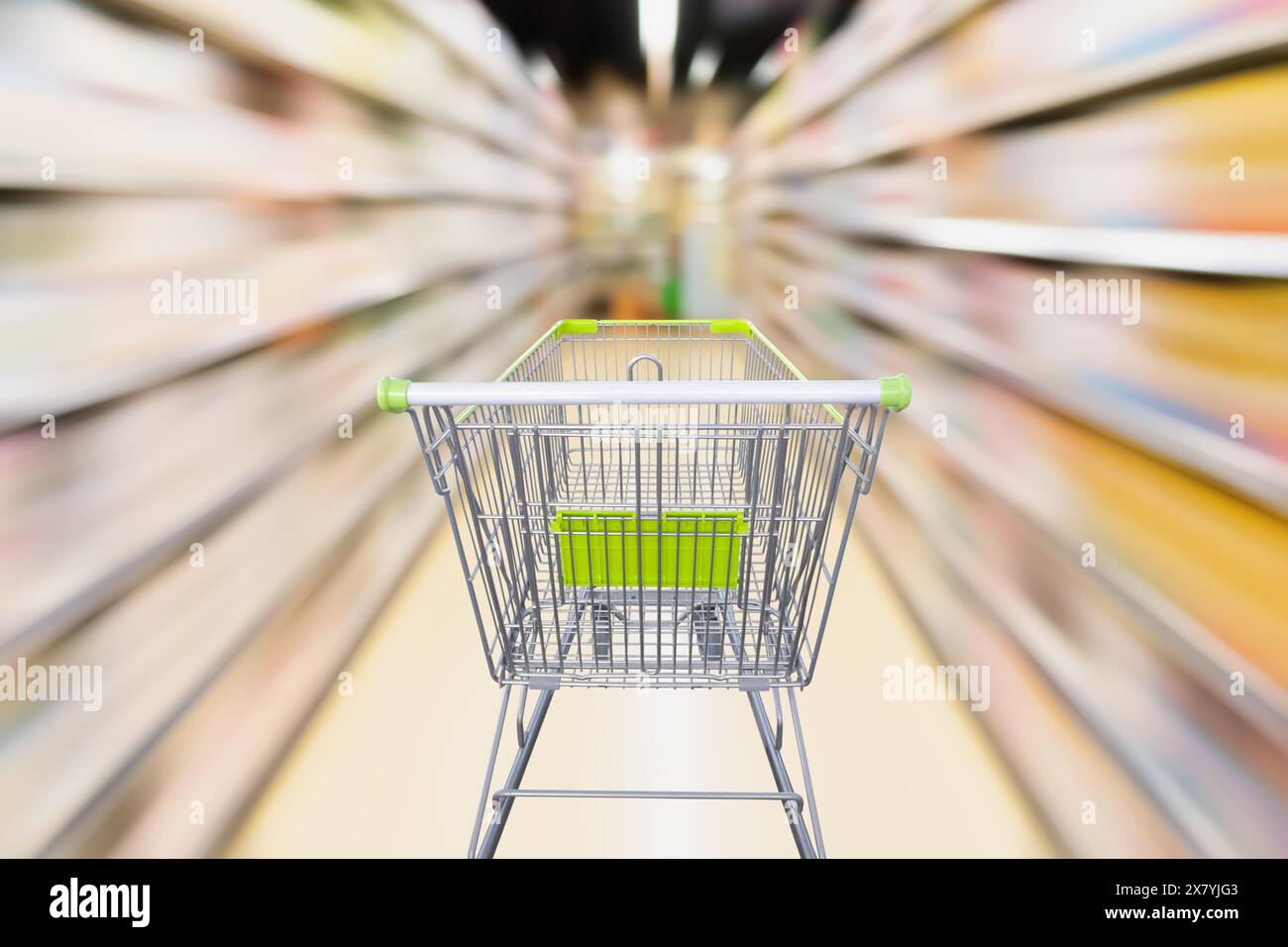 empty shopping cart with blur supermarket aisle with baby formula milk ...
