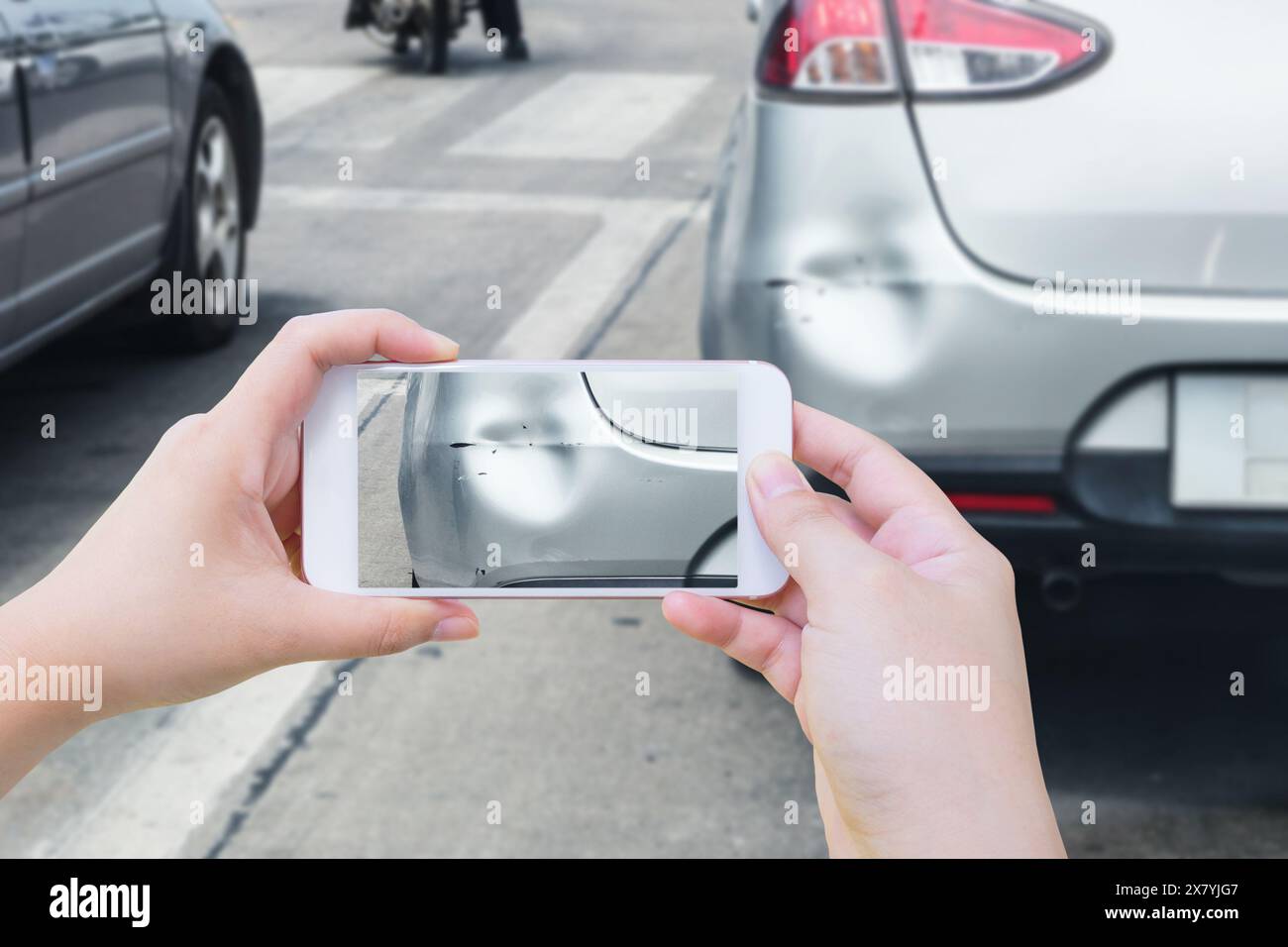 Hand using mobile smart phone taking photo of the car crash accident ...