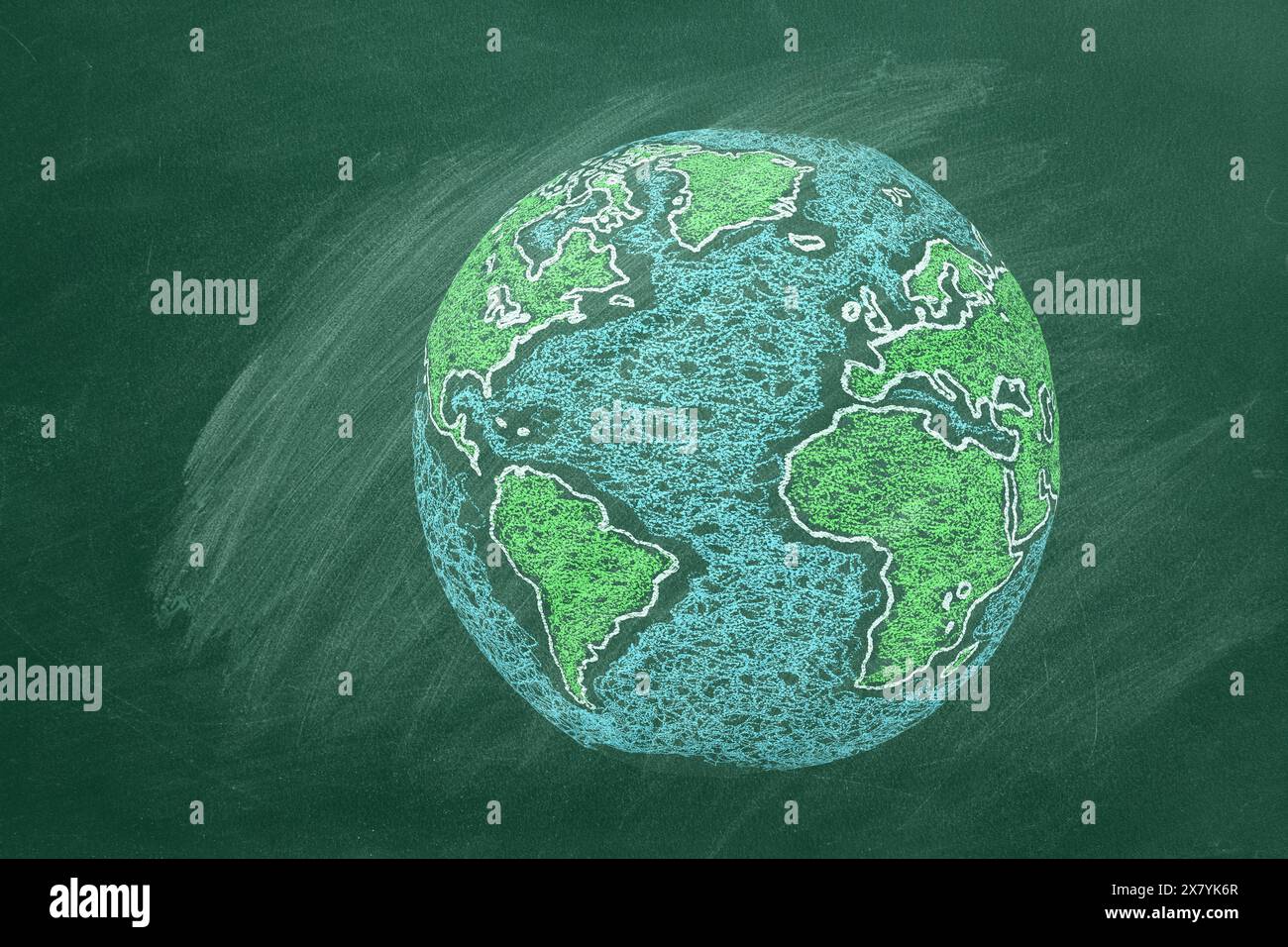 A chalk-drawing of Earth on a green classroom blackboard, showing ...
