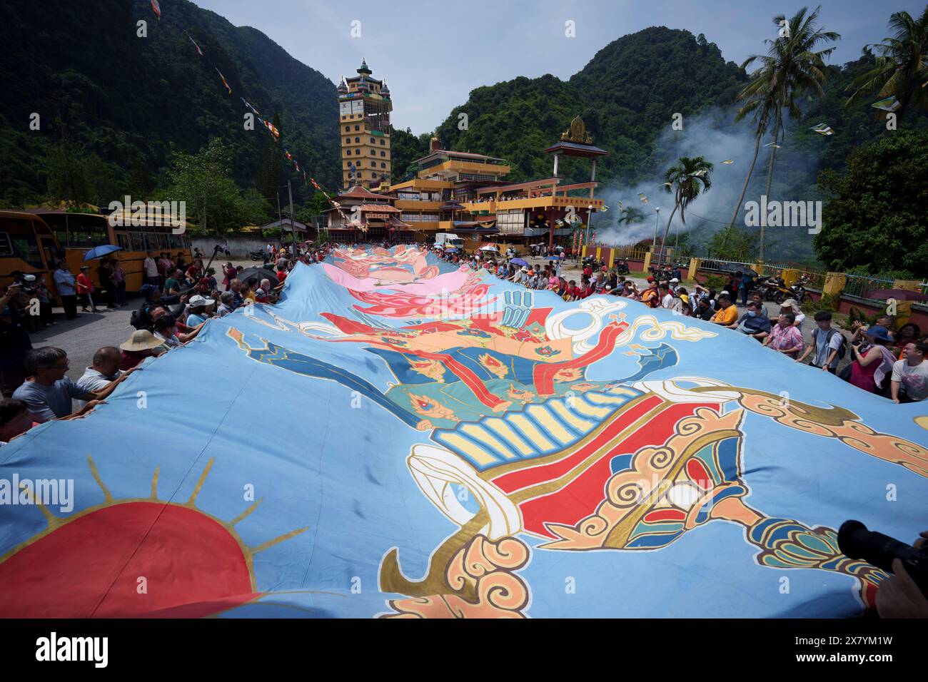 Devotees unveil a giant canvas of sacred "Thangka" measuring 60 meters ...