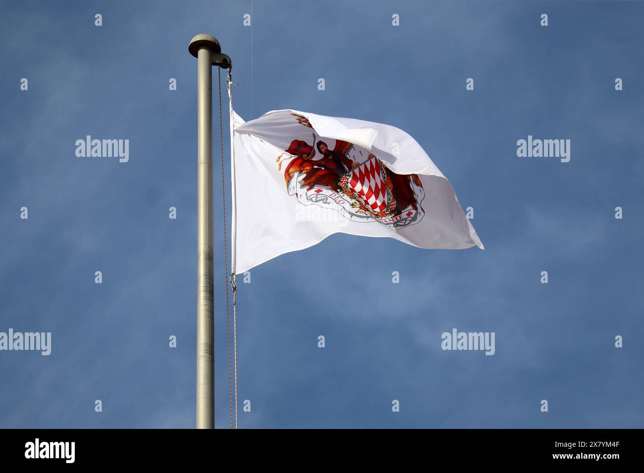 Flag of the Principality of Monaco over the Castle of Grimaldi Stock ...