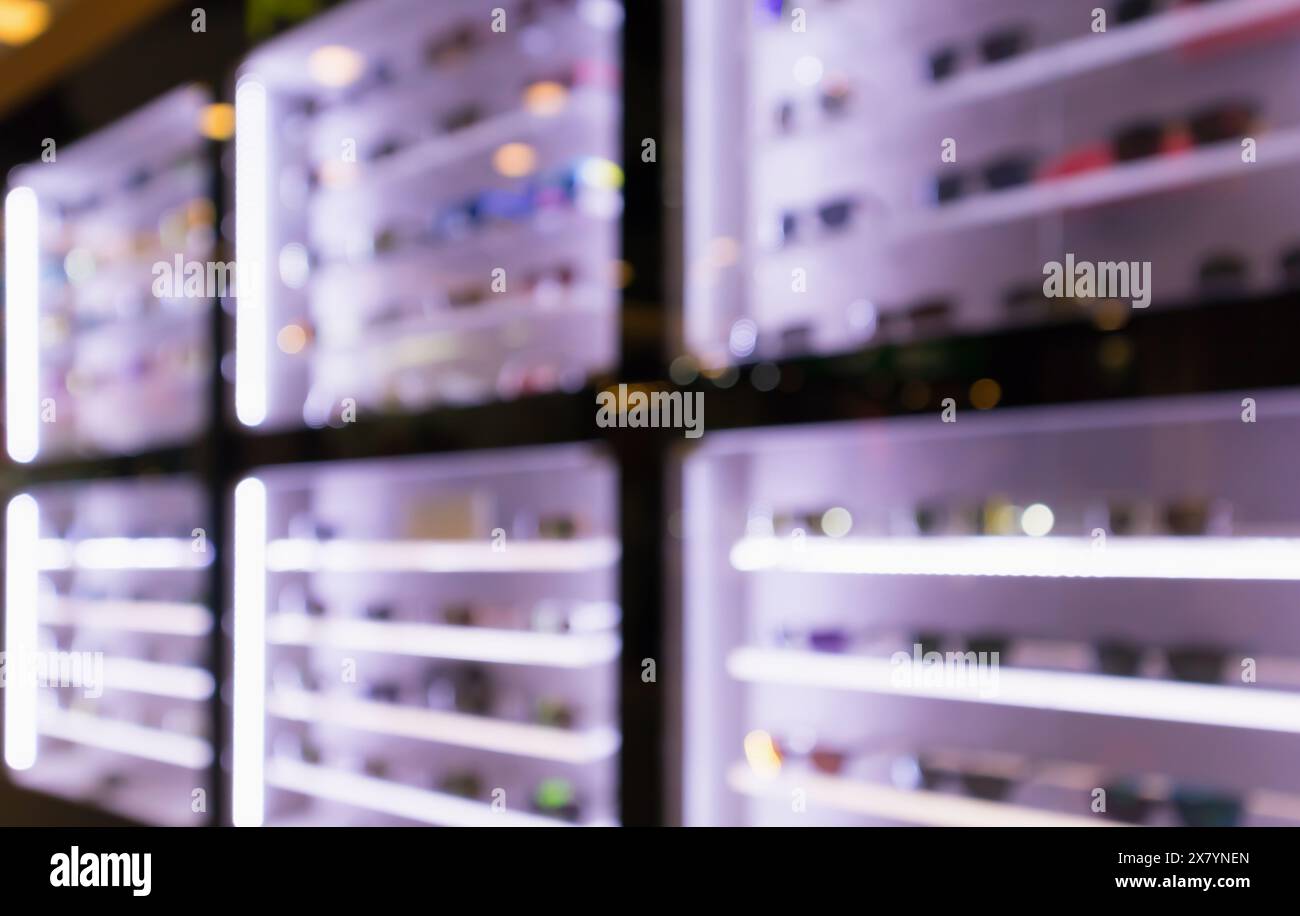 Blur Sunglasses on display shelves in glasses store background Stock ...