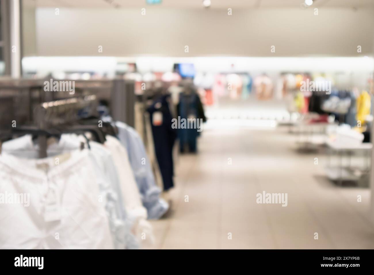 clothing store interior abstract blur background Stock Photo - Alamy