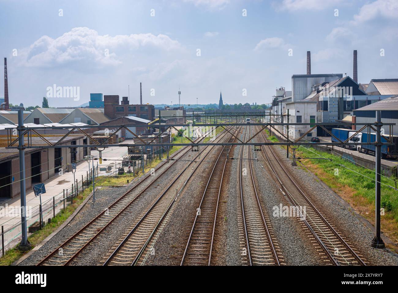 Perspective image of railroad tracks near the train station of ...