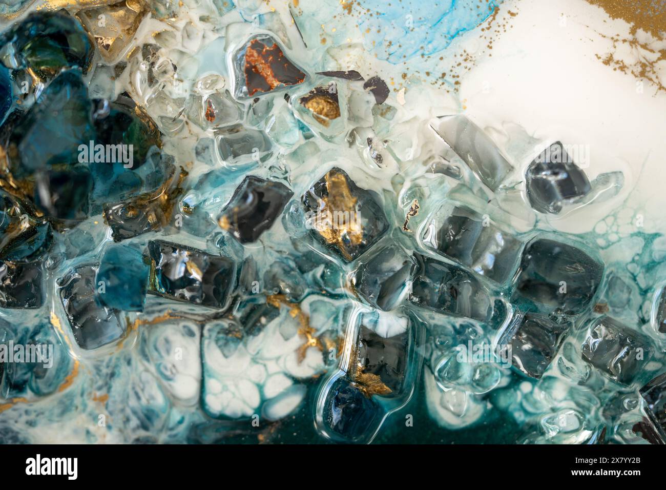 Closeup of epoxy resin with natural minerals, crystals and stones ...